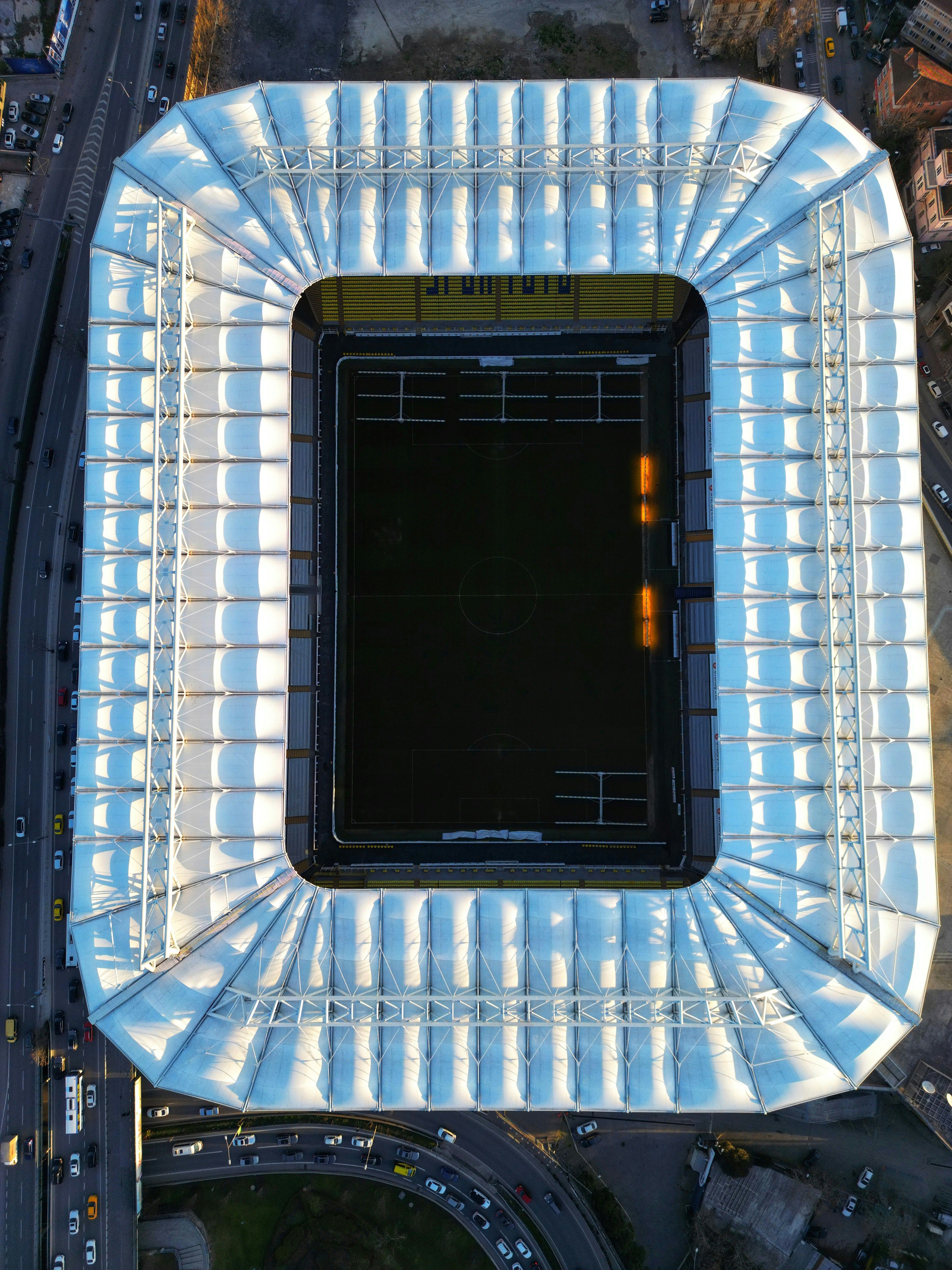 Glowing Canopy Rings: Aerial View of a Stadium's Center Field