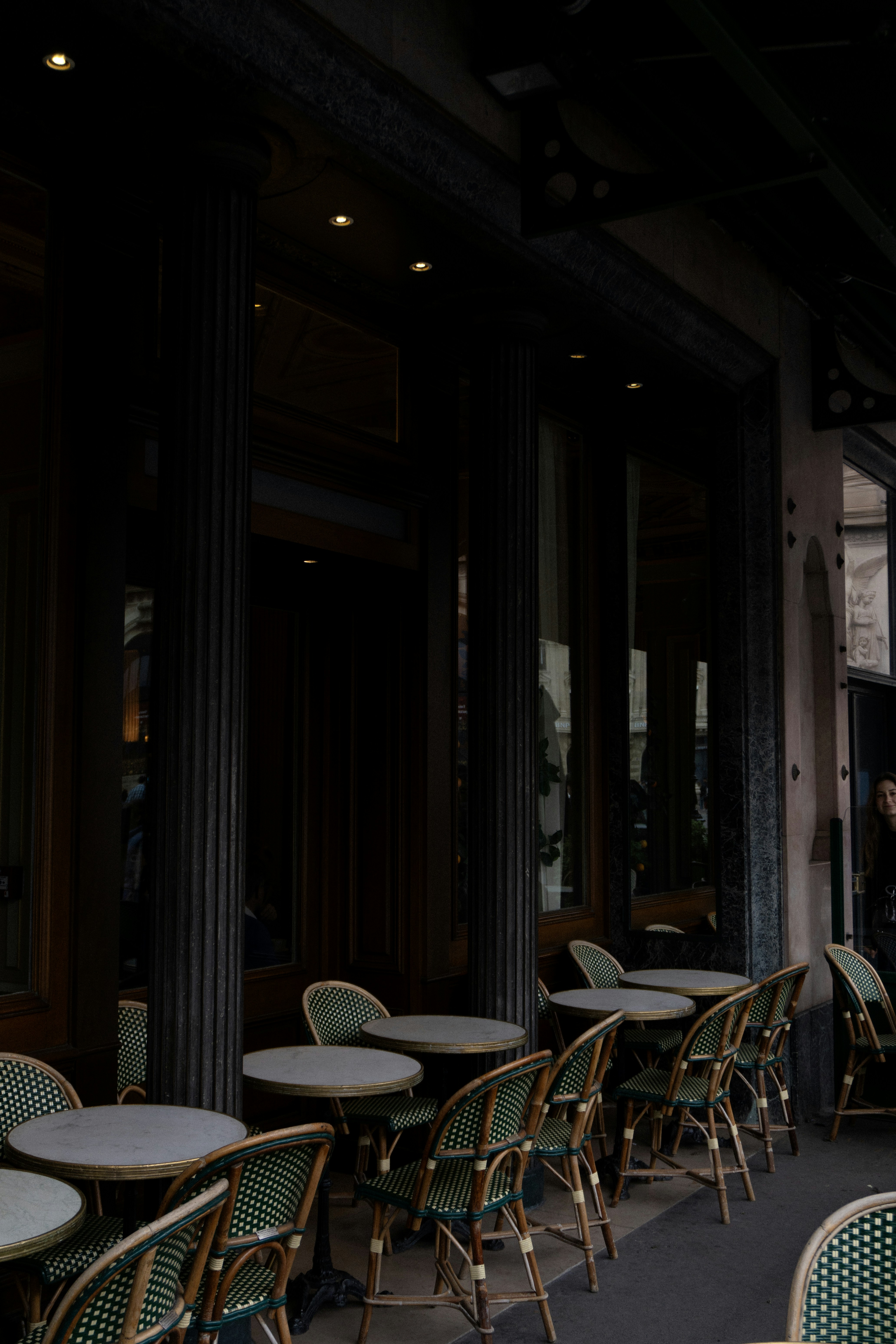 A row of tables and chairs outside of a restaurant photo – Free ...