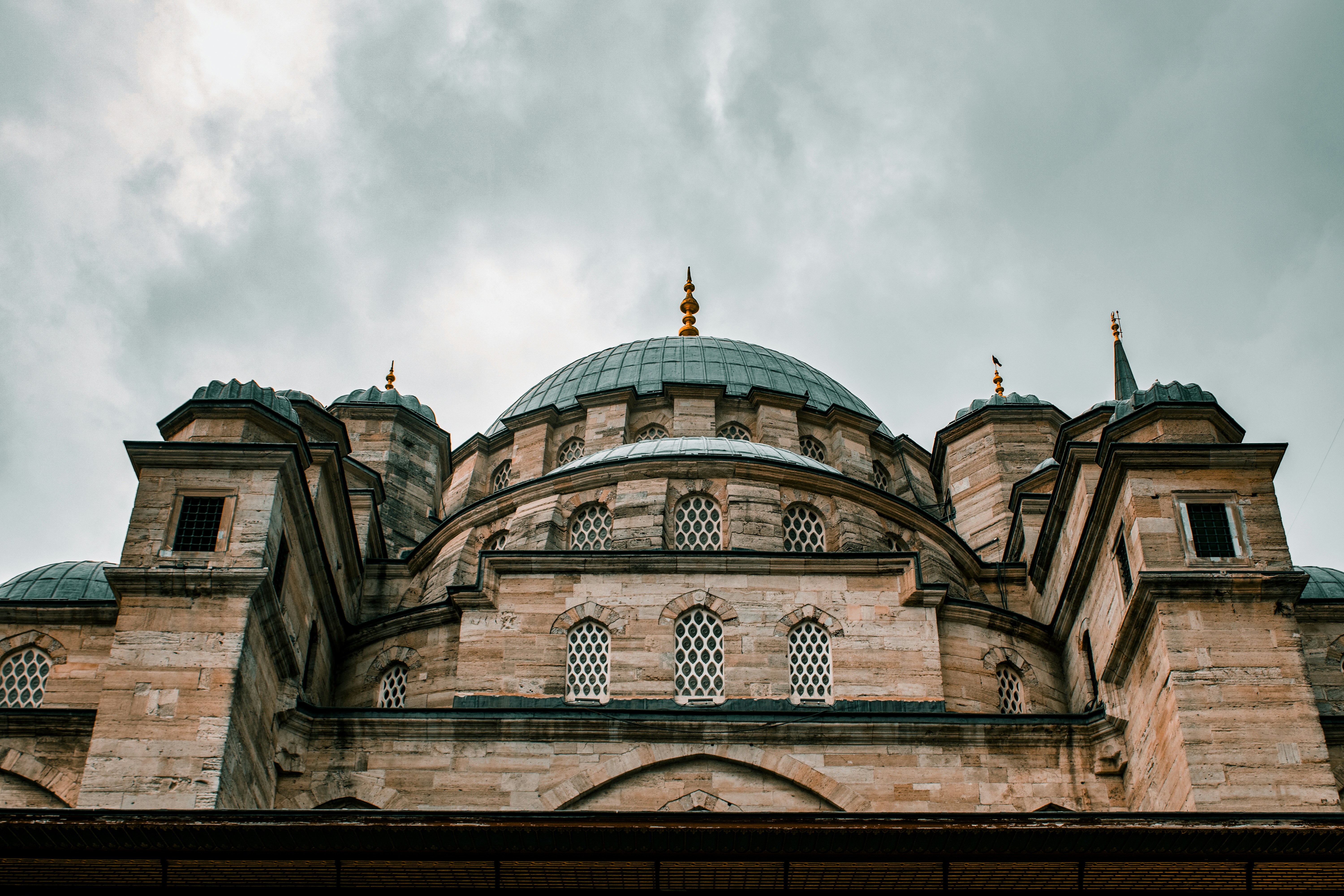 Dome Rising: A Low-Angle Portrait of a Historic Facade Under Grey Skies