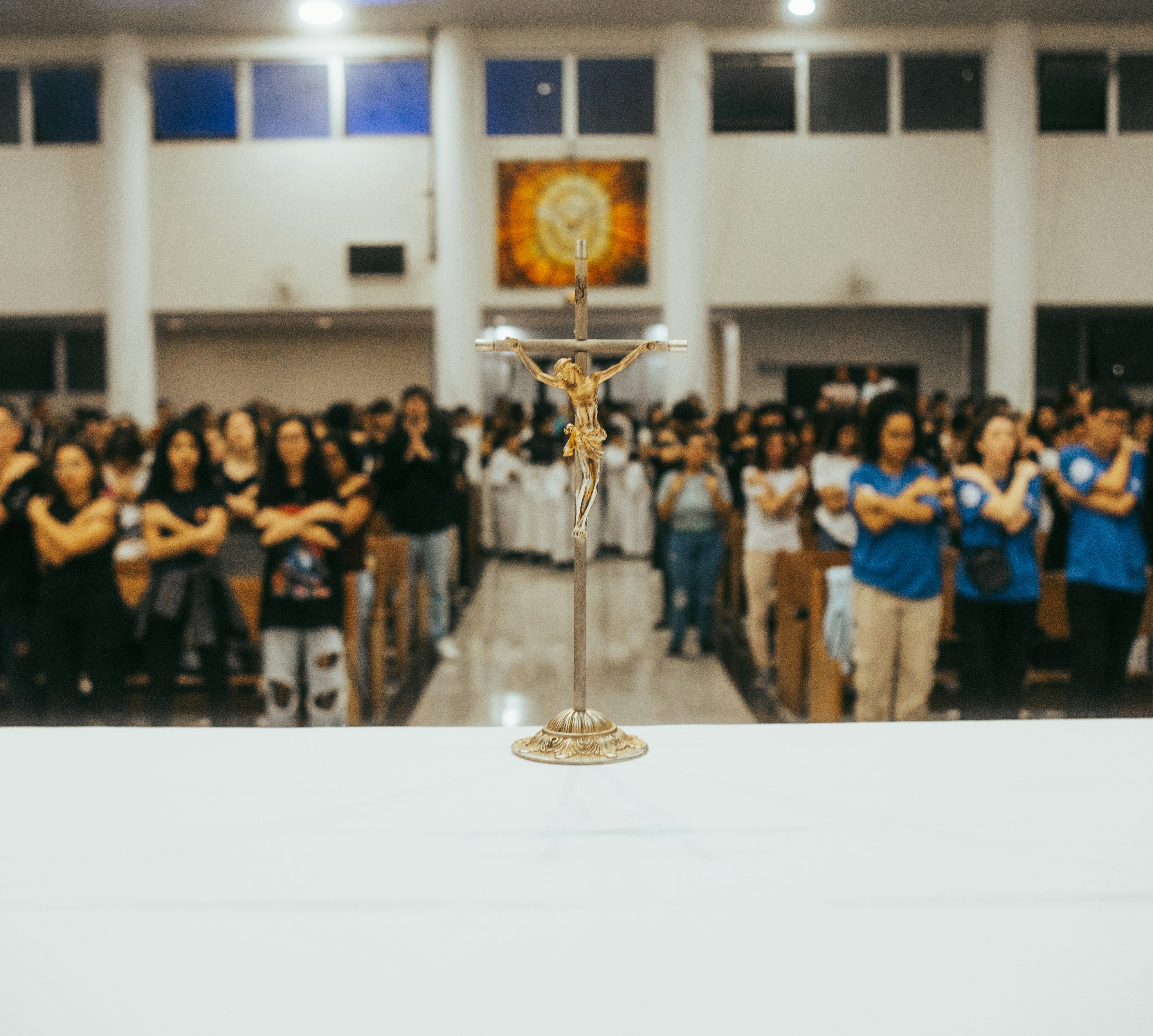 Center Cross in Focus: Quiet Reverence in a Church Hall