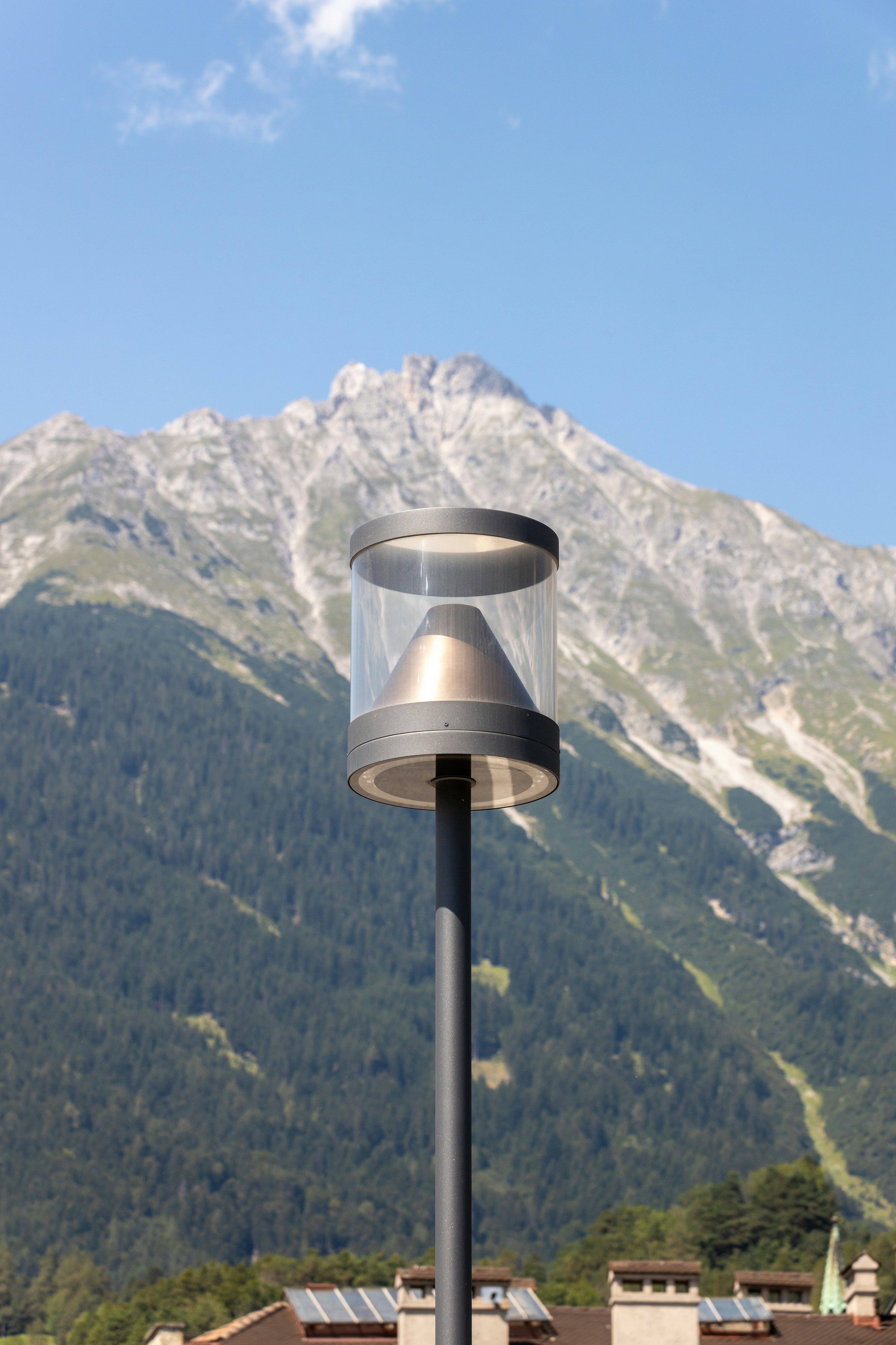 Translucent Lantern Framing an Alpine Horizon