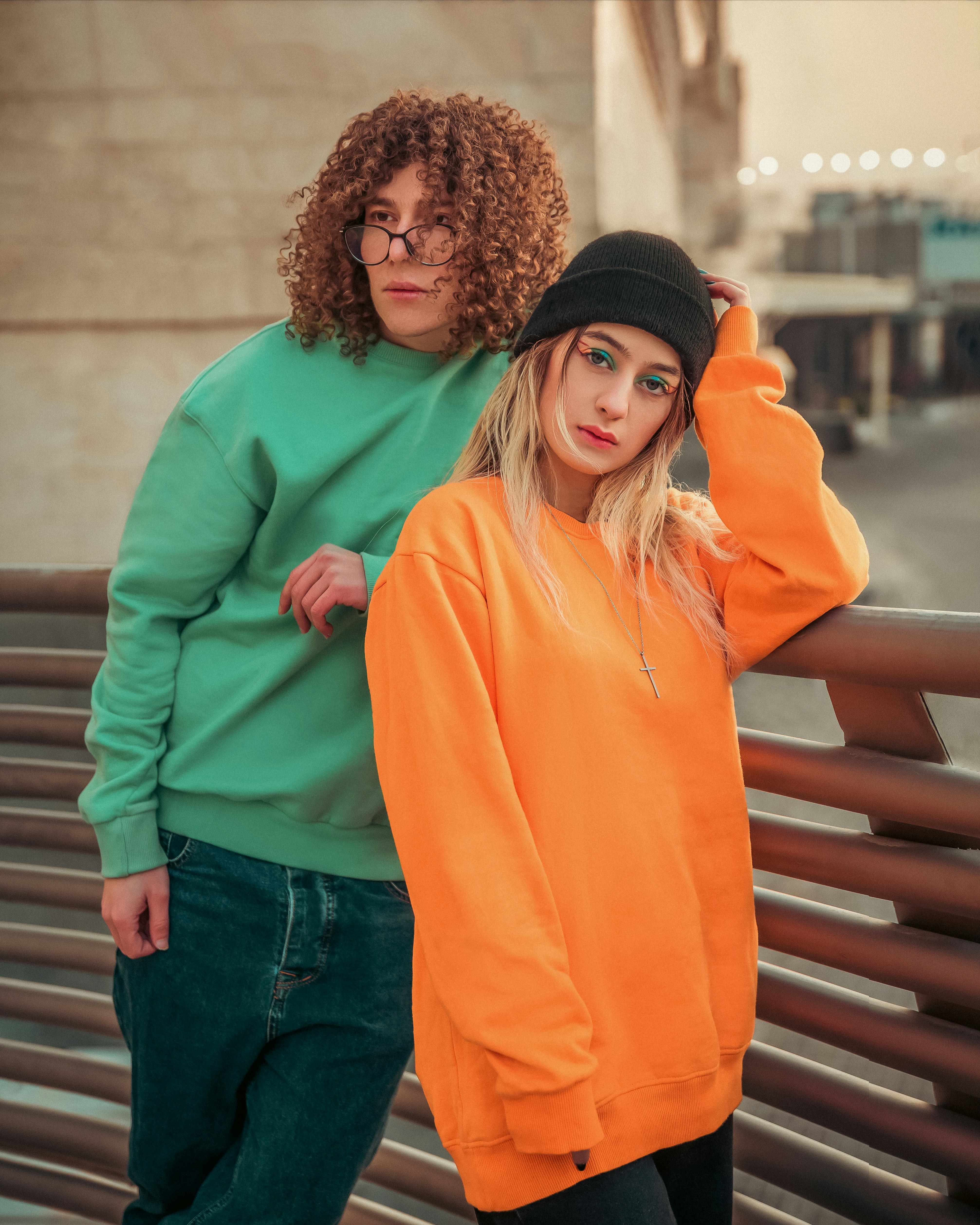 Orange Hoodie Echoes: A Riverside Street Portrait