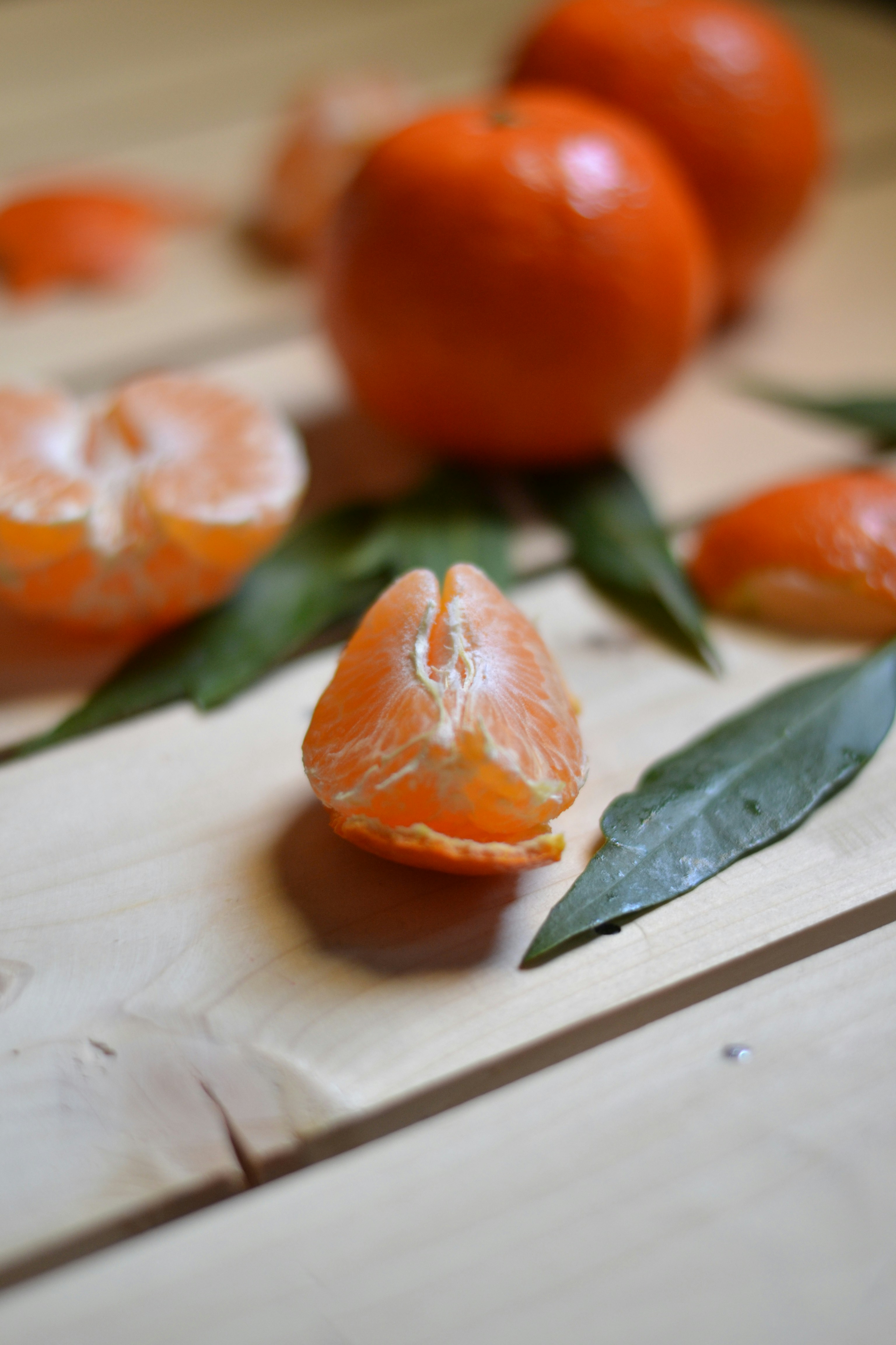 Mandarin Fragments on Sun-Warmed Wood