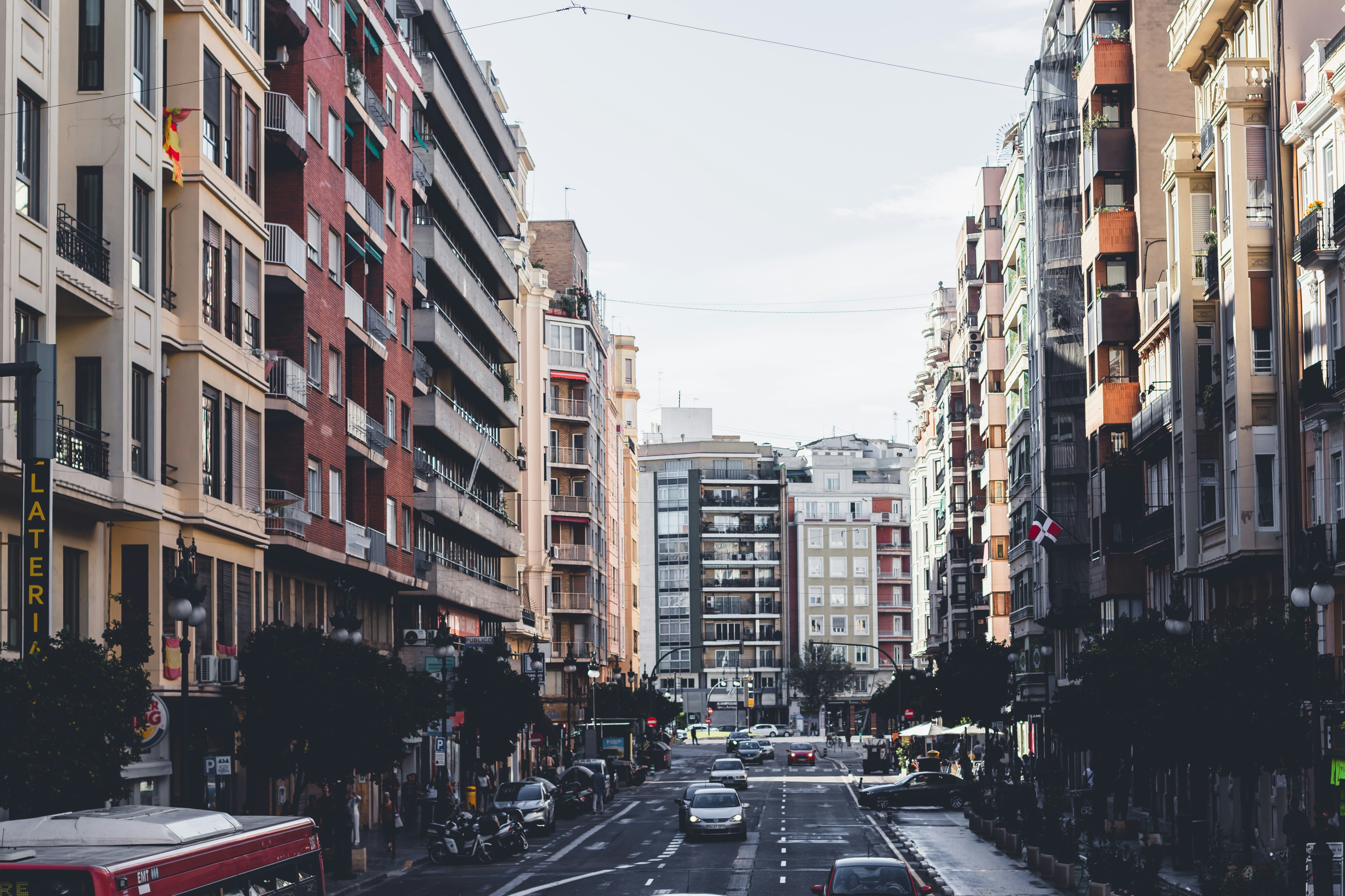 A city street filled with lots of tall buildings