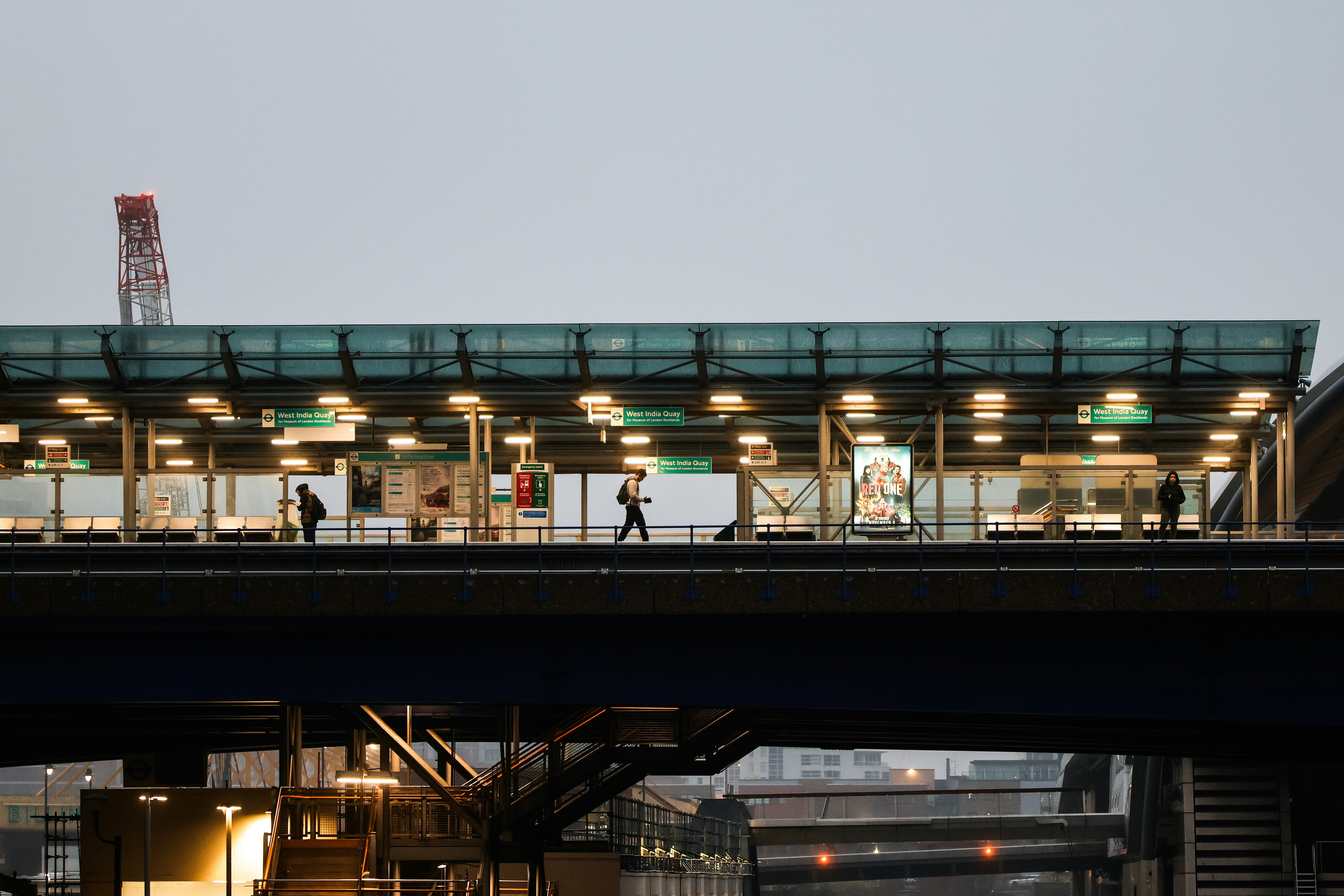 A bridge with people walking across it at night photo – Free Canary ...