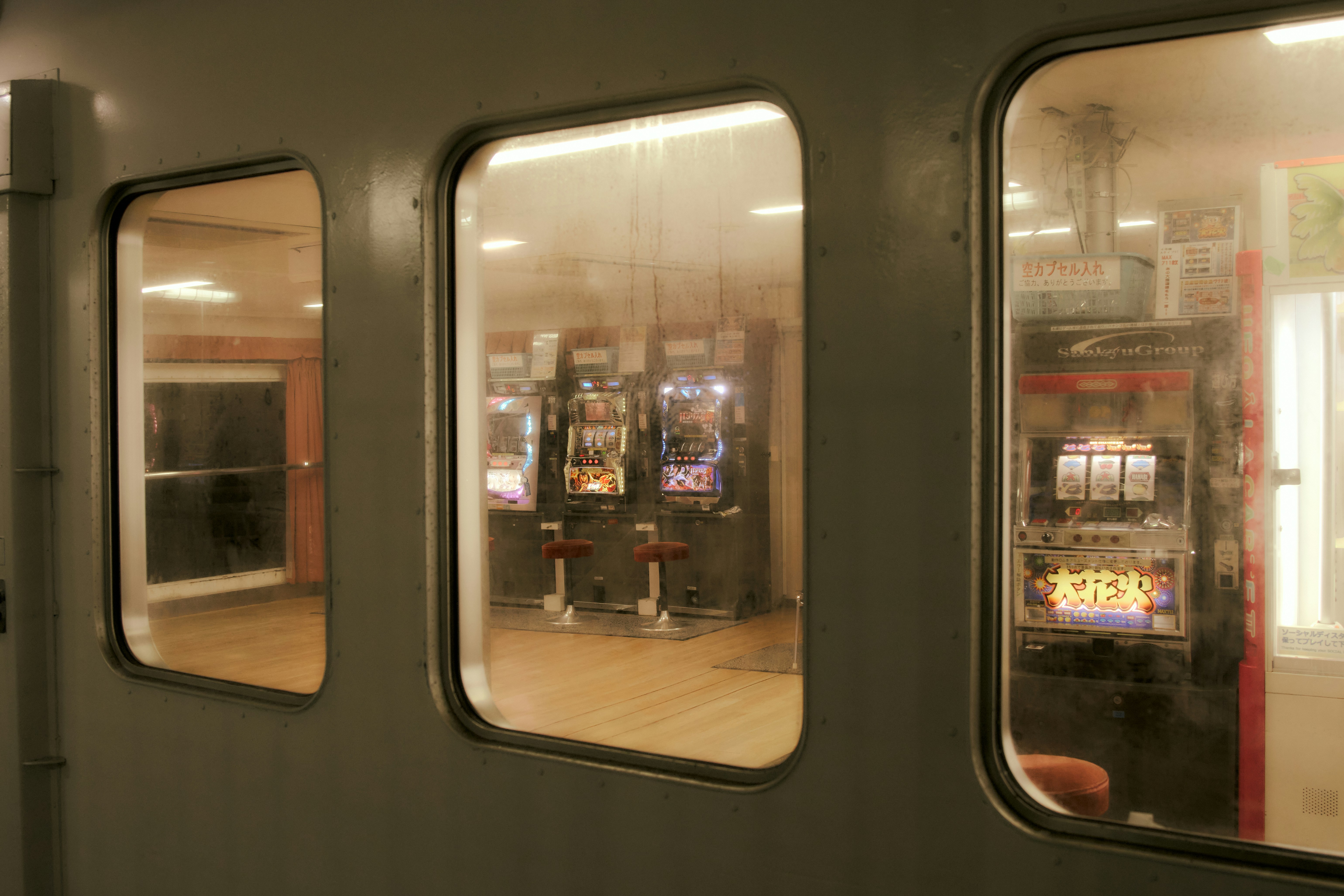 Amber Stillness: Vending Machines Framed by a Subway Window