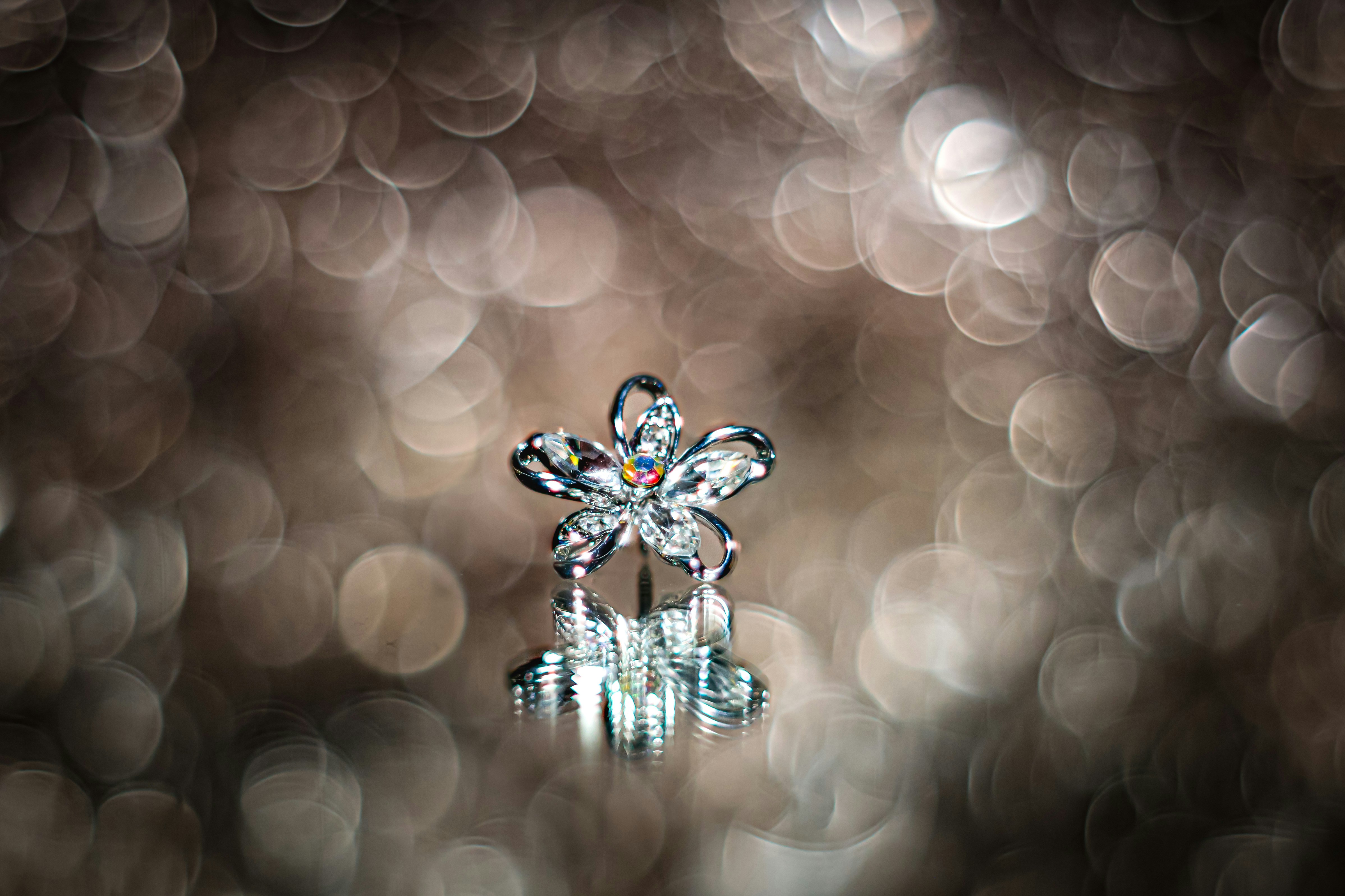 Glass Bloom: A Tiny Crystal Flower Emerges from a Sea of Bokeh