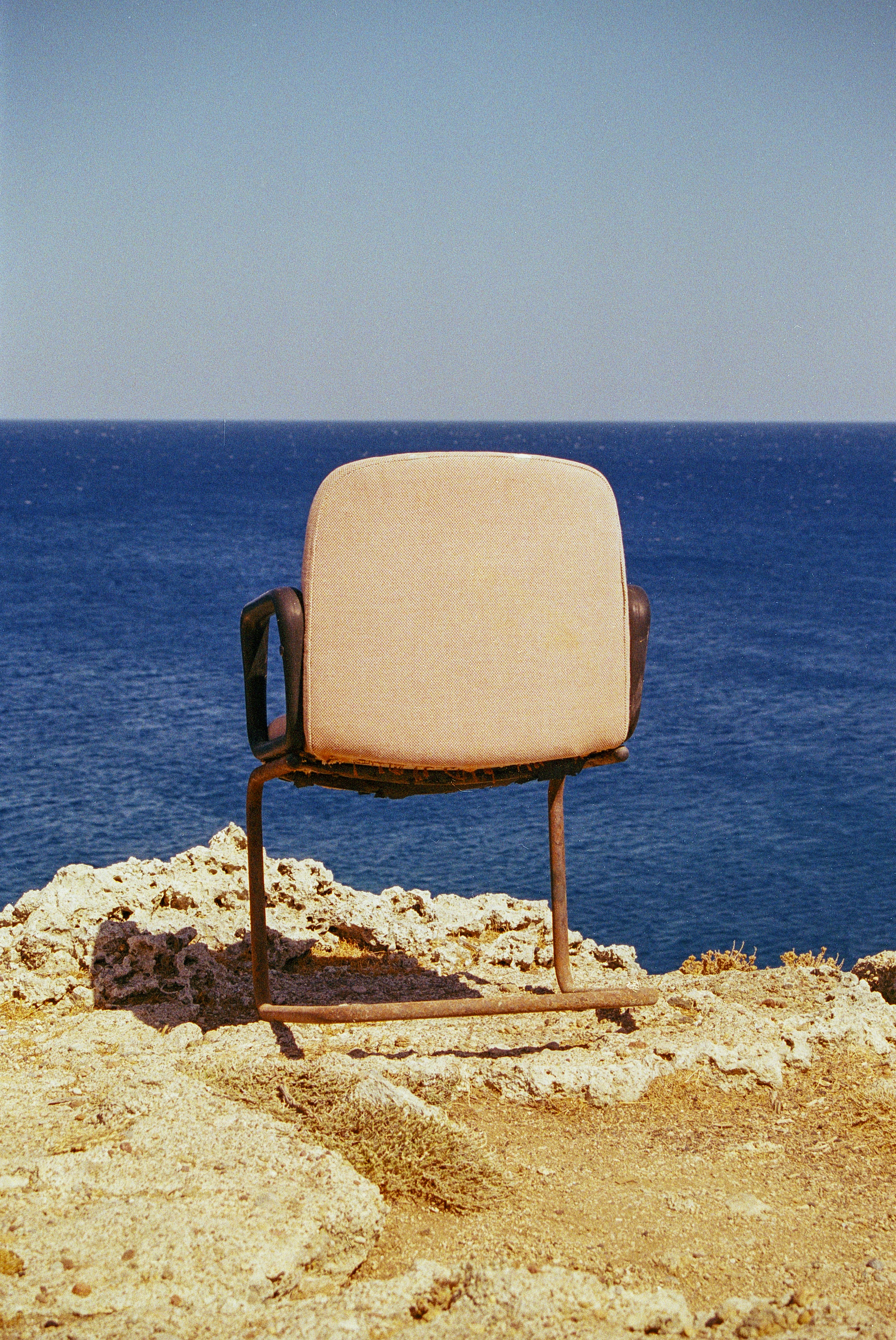 Abandoned Sea-Edge Chair: A Quiet Portrait at Dusk