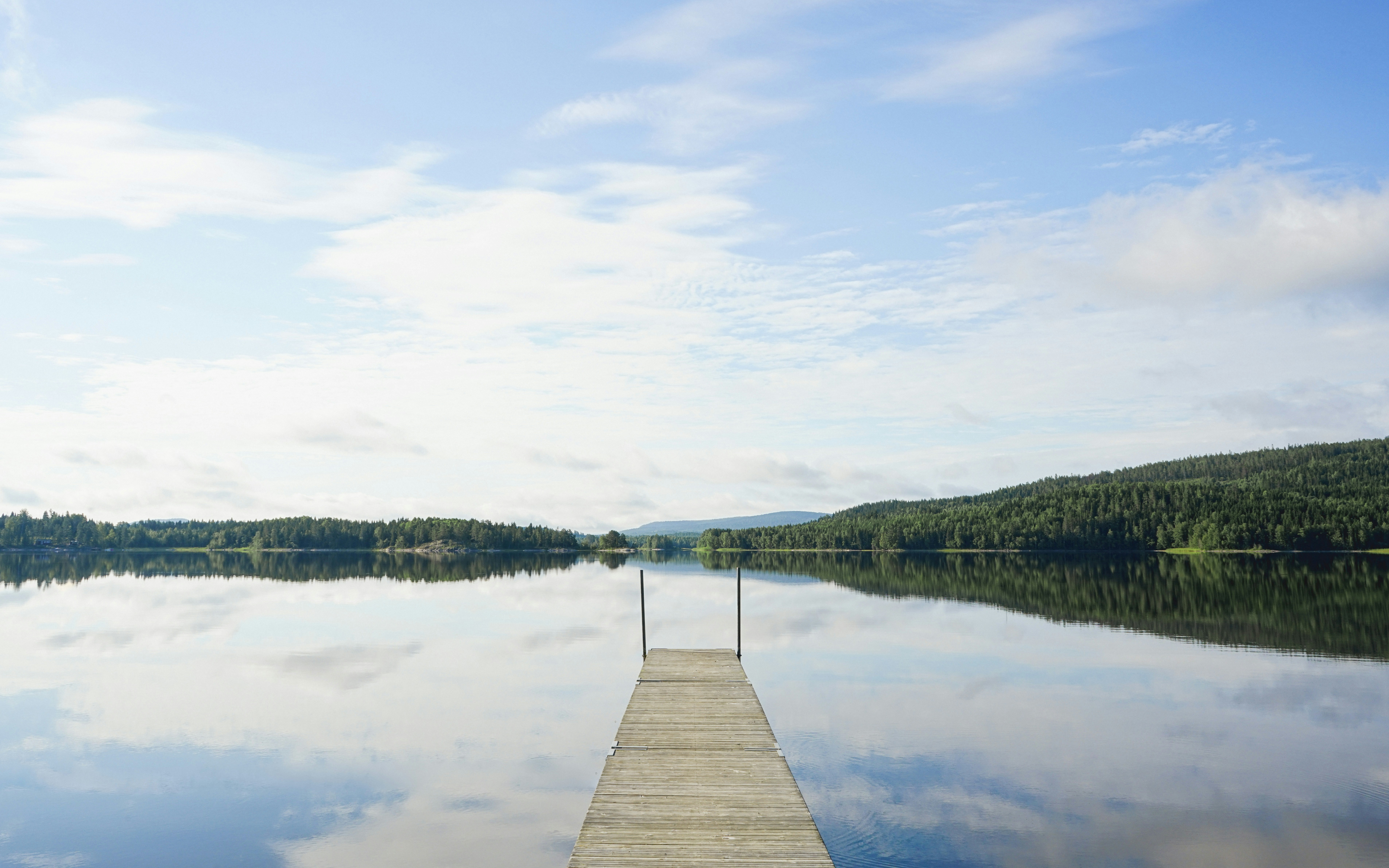 A long dock extends into a calm lake photo – Free Storsjön Image on ...