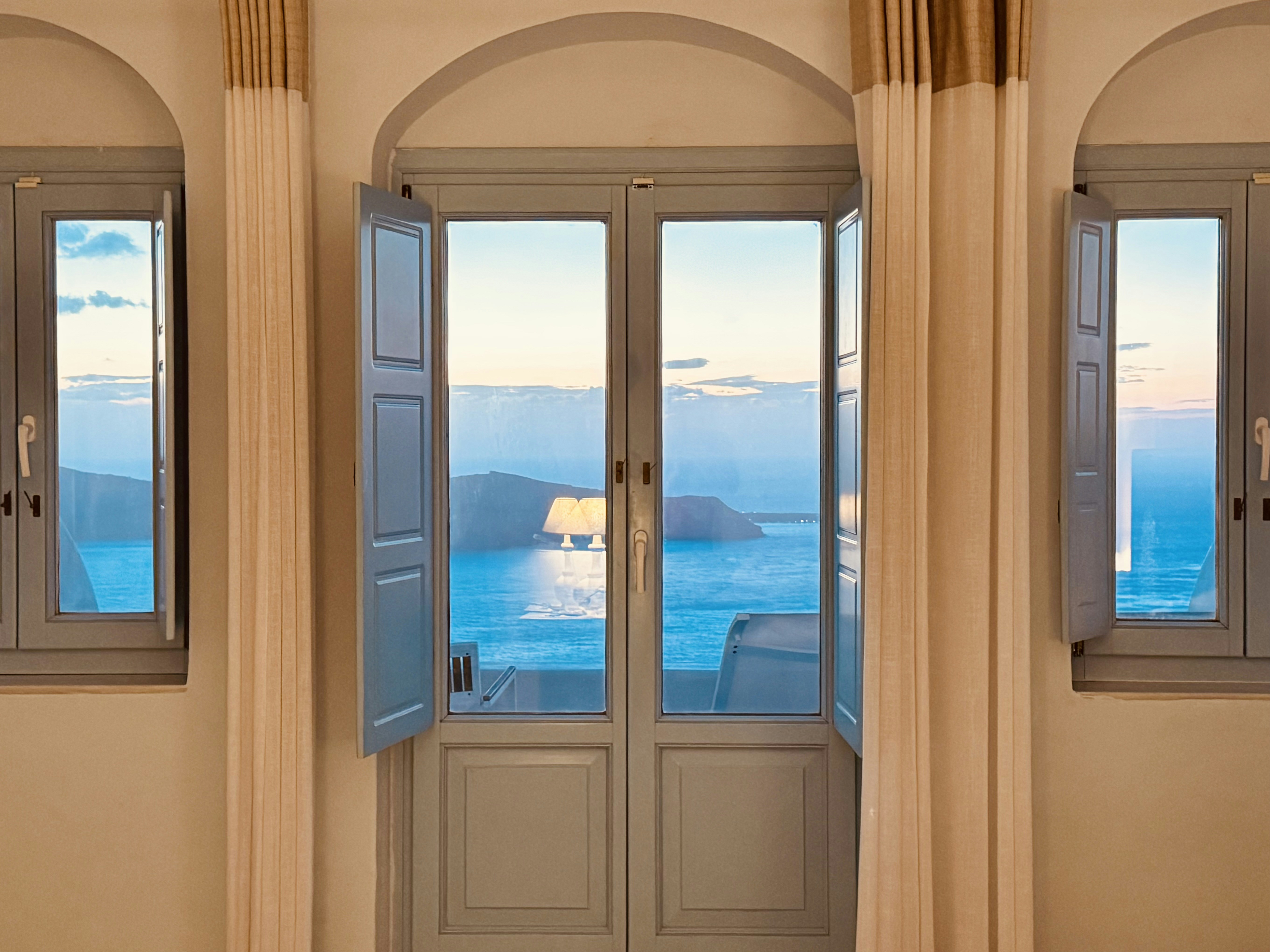 Sea Vista Framed by Open Balcony Doors