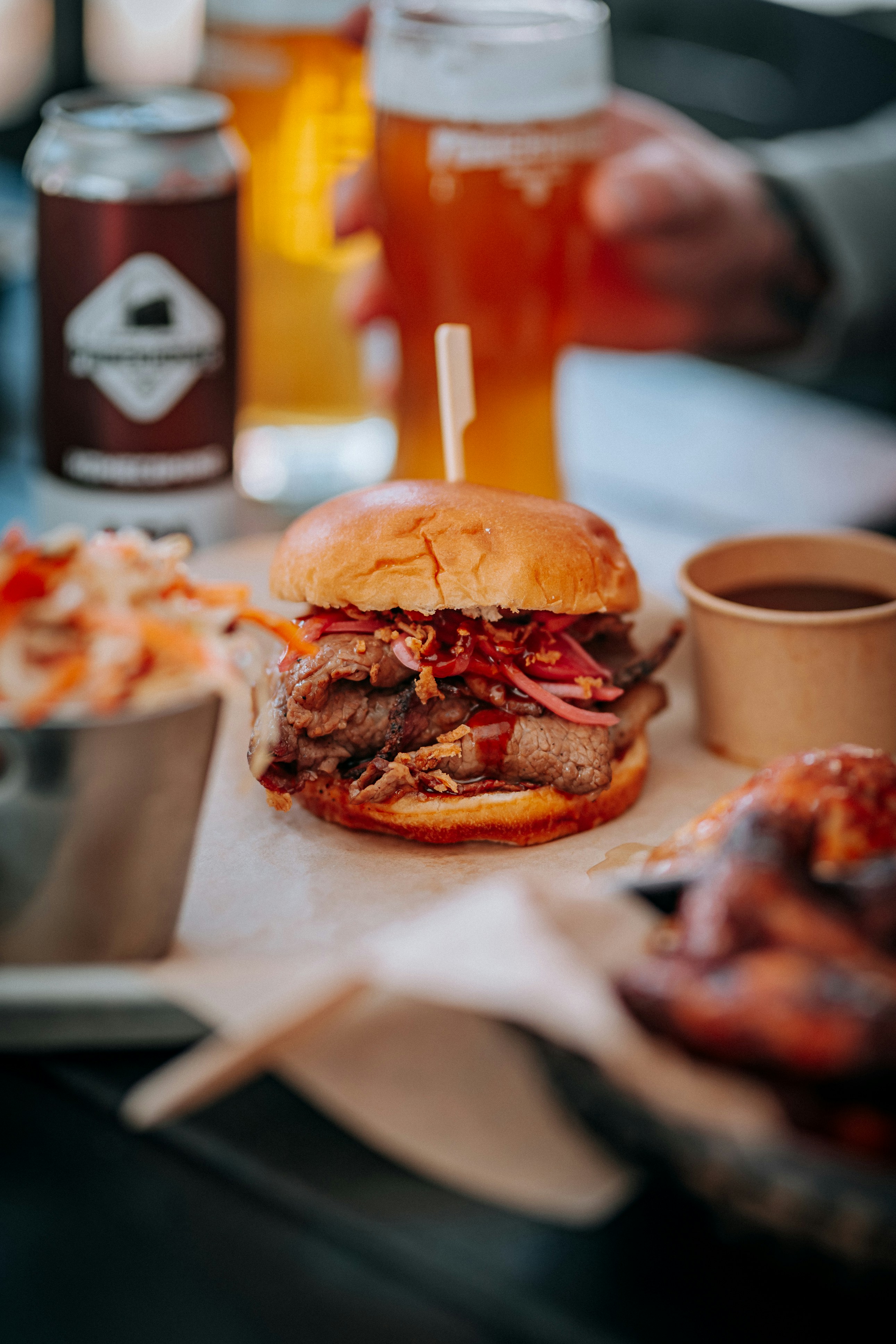 Juicy Smash Burger on a Pint-Filled Table