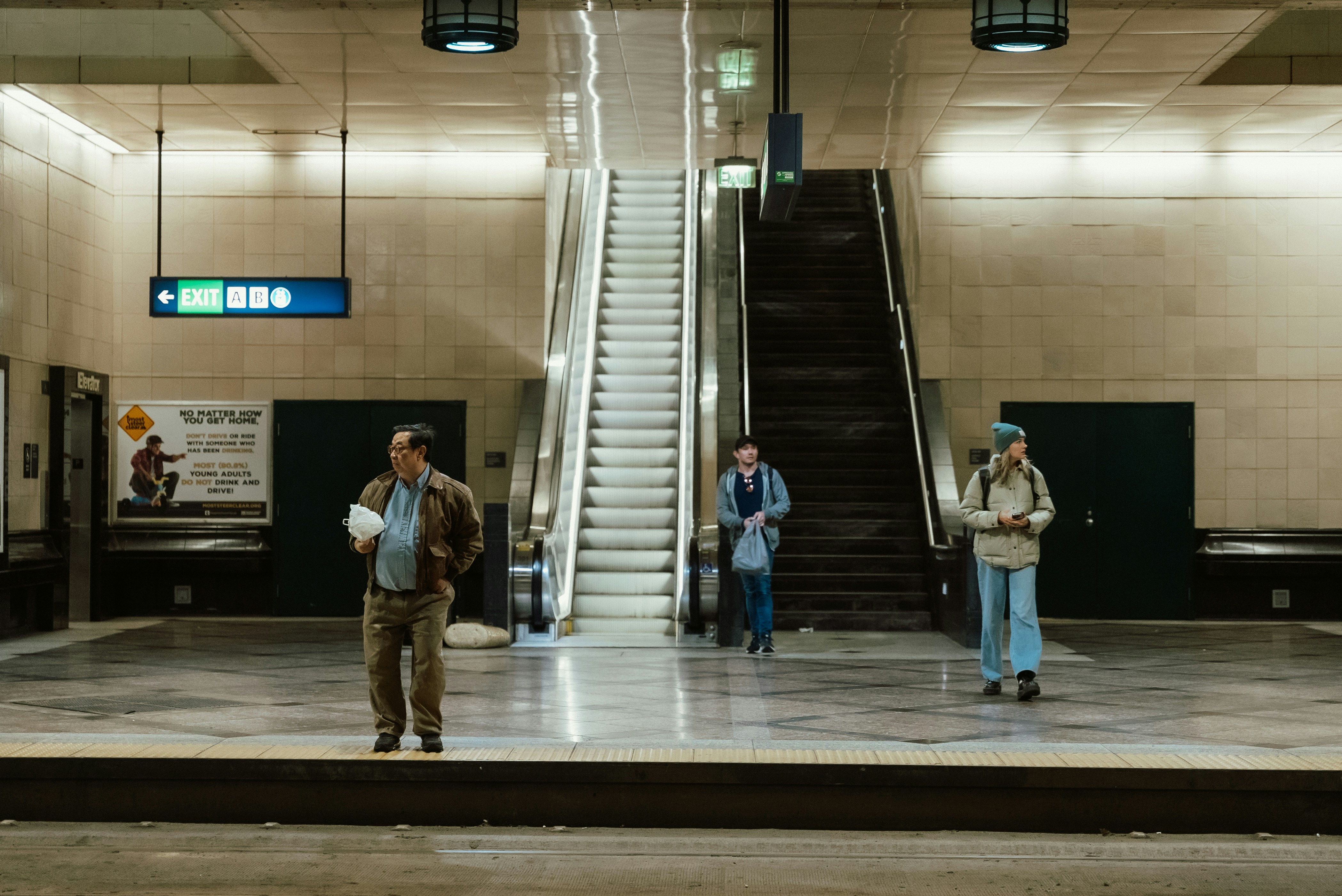 A group of people standing on a train platform photo – Free Seattle ...