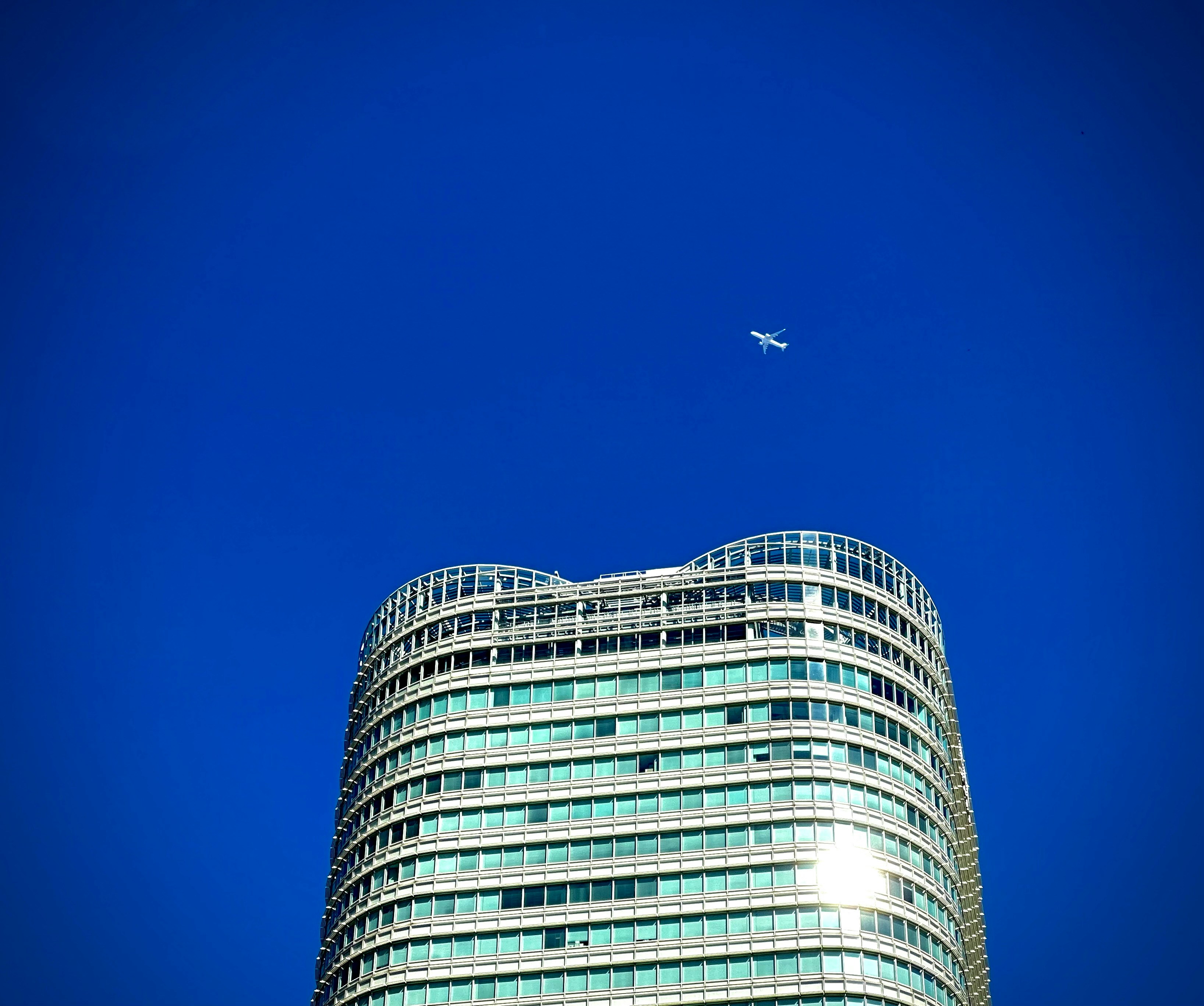 Skyward Glass: A Tower Piercing the Azure
