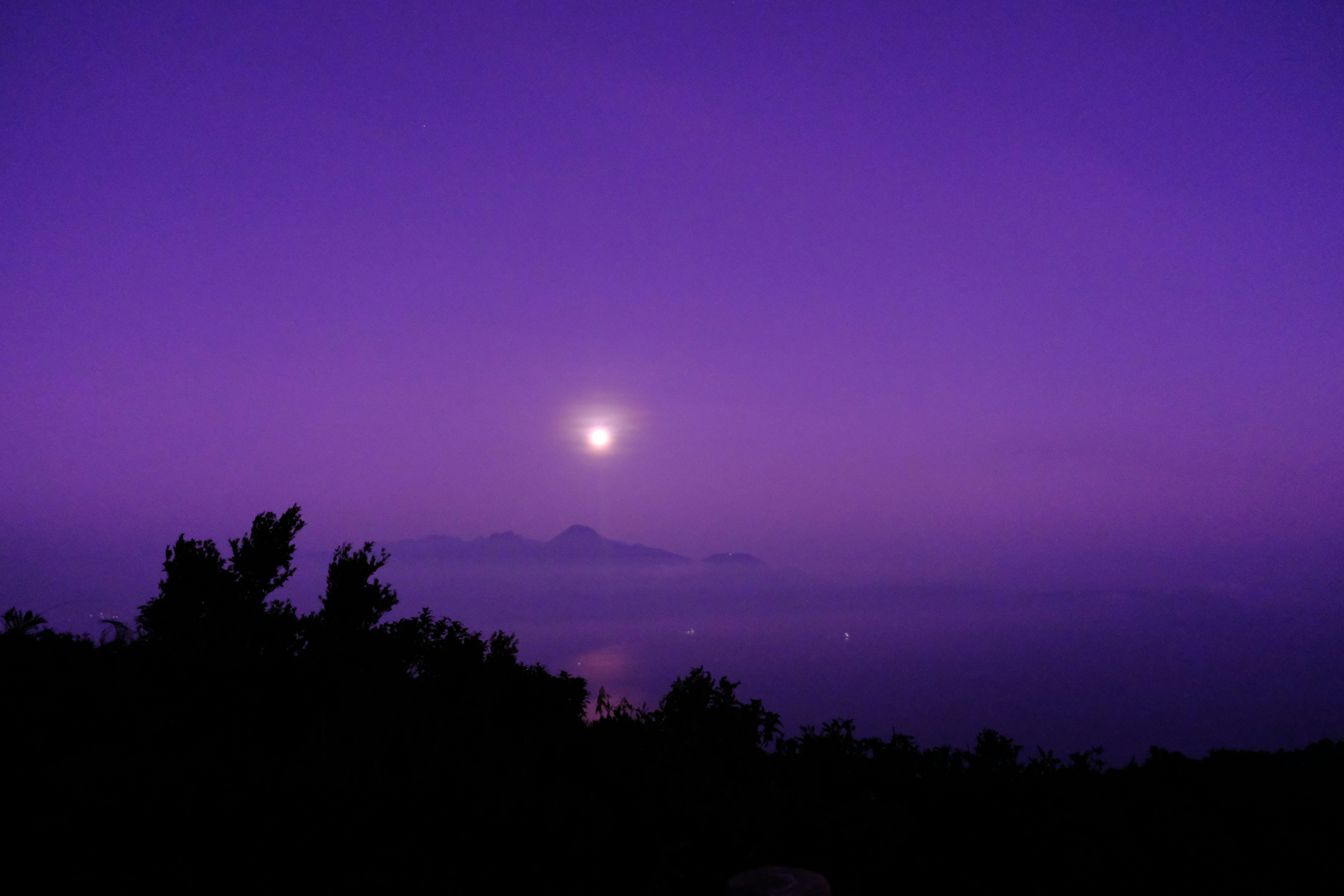 A purple sky with the moon in the distance photo – Free Nature Image on ...
