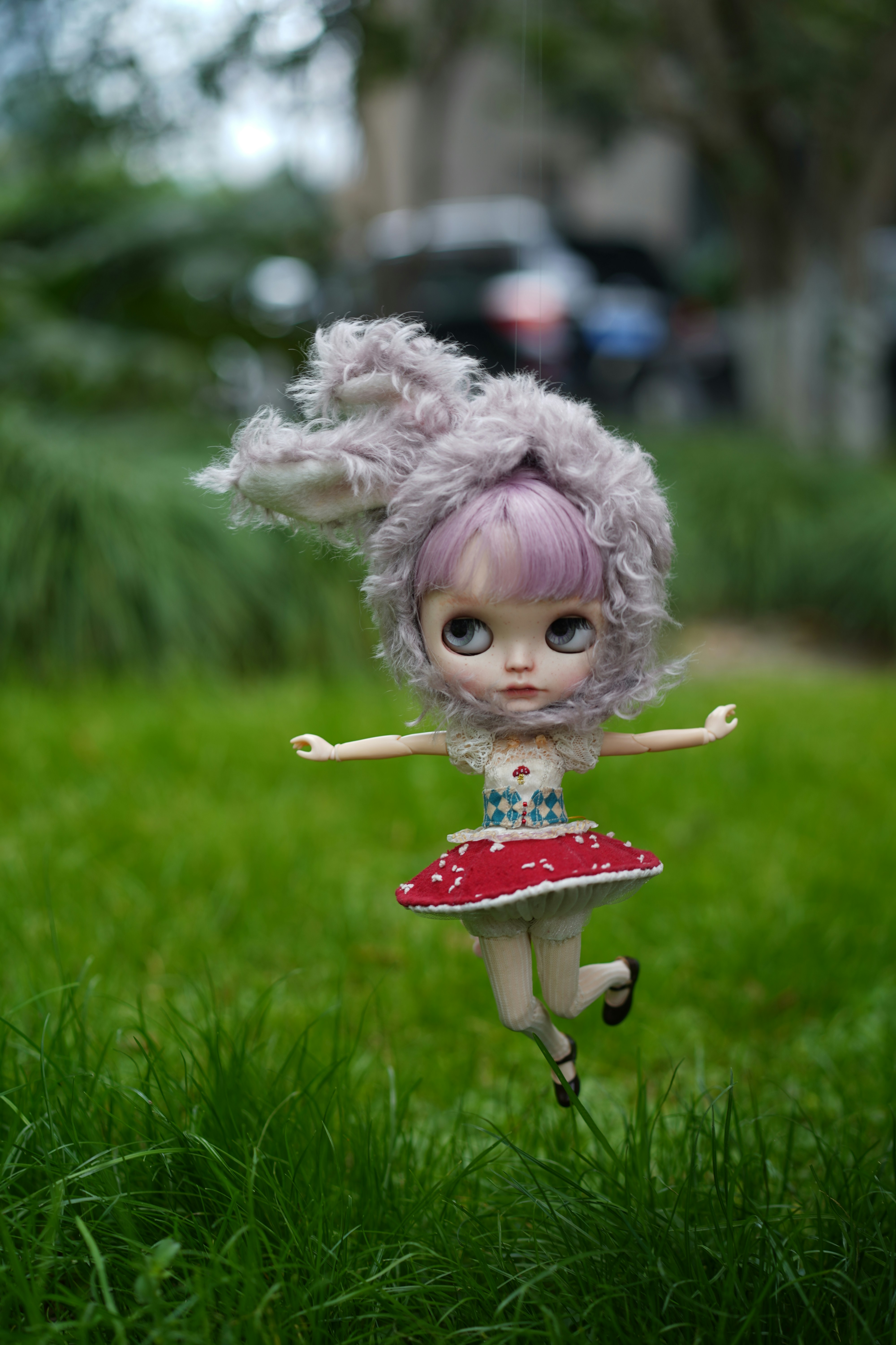 A doll is flying through the air in the grass photo – Free Grass Image ...