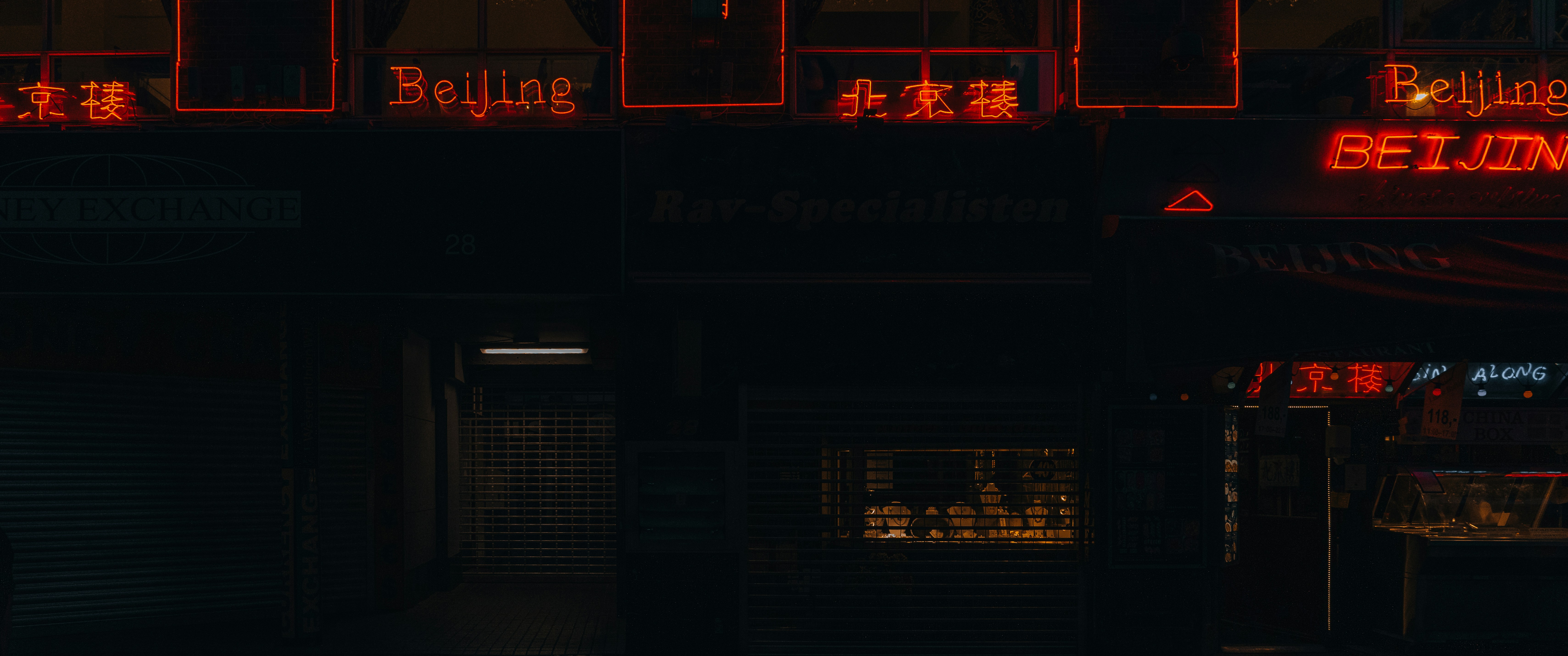 A building that has a bunch of neon signs on it photo – Free Copenhagen ...