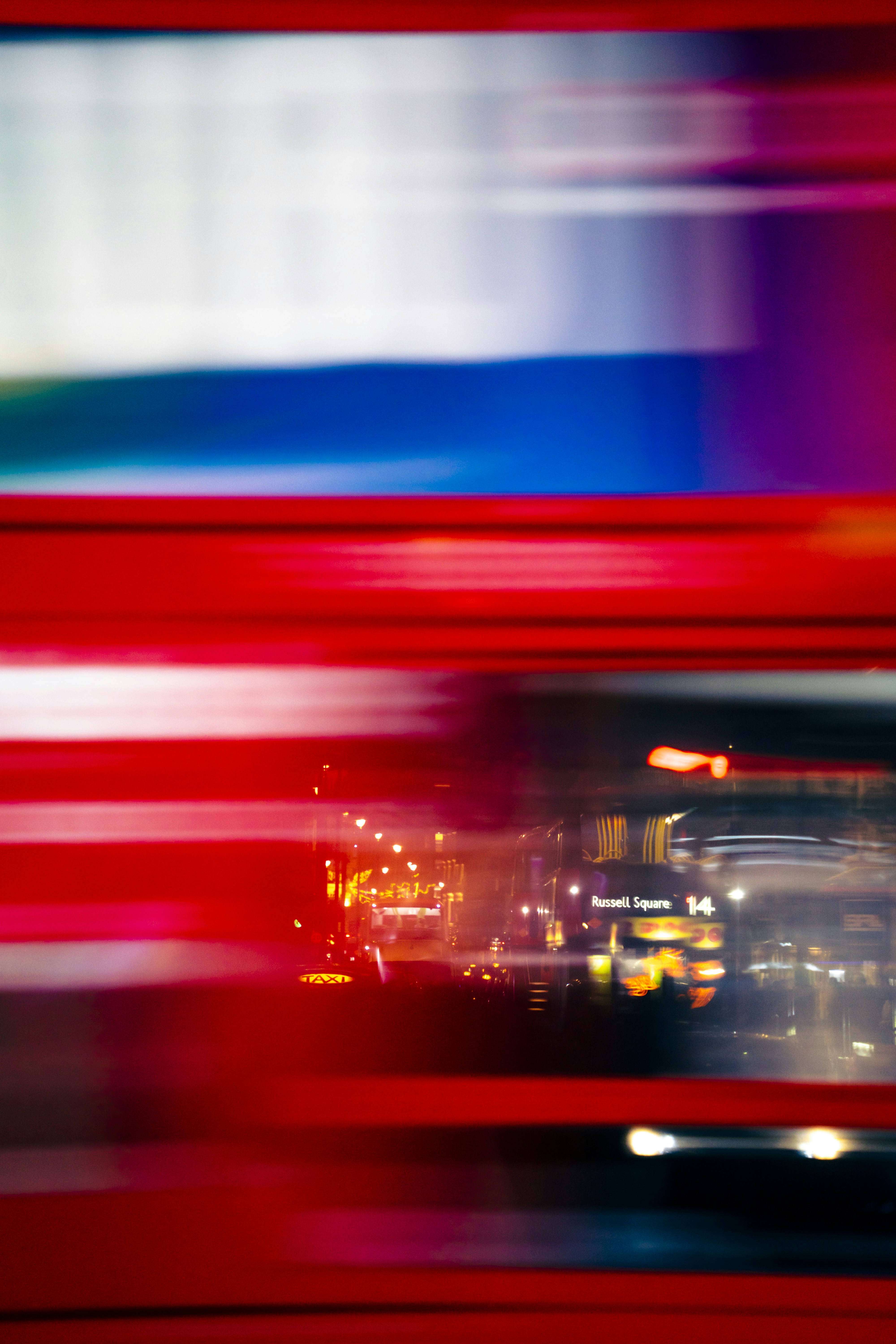 Crimson Motion: A Glimpse Through Blurred City LightsJeffrey Zhang