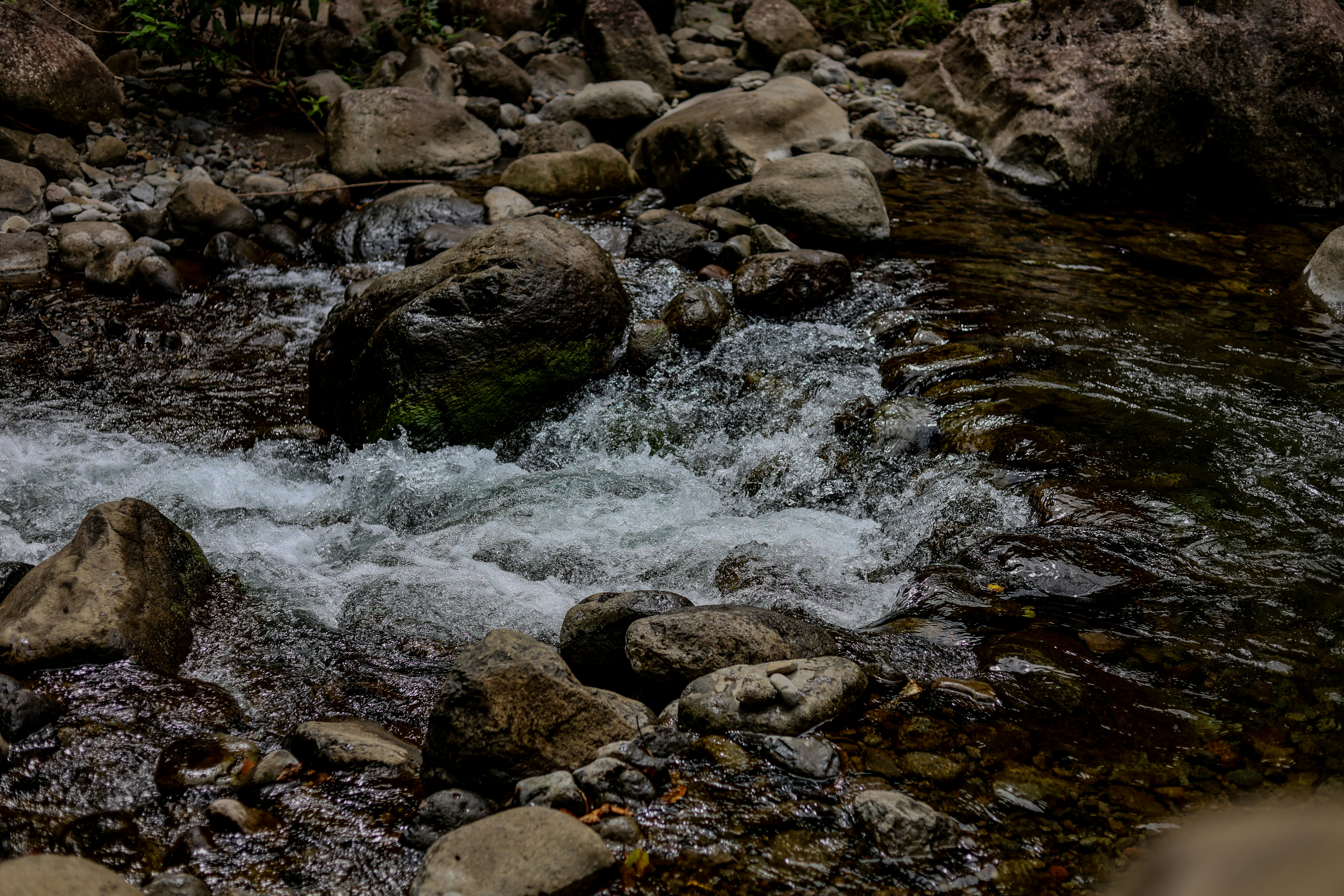 A stream of water running through a rocky hillside photo – Free Hana ...
