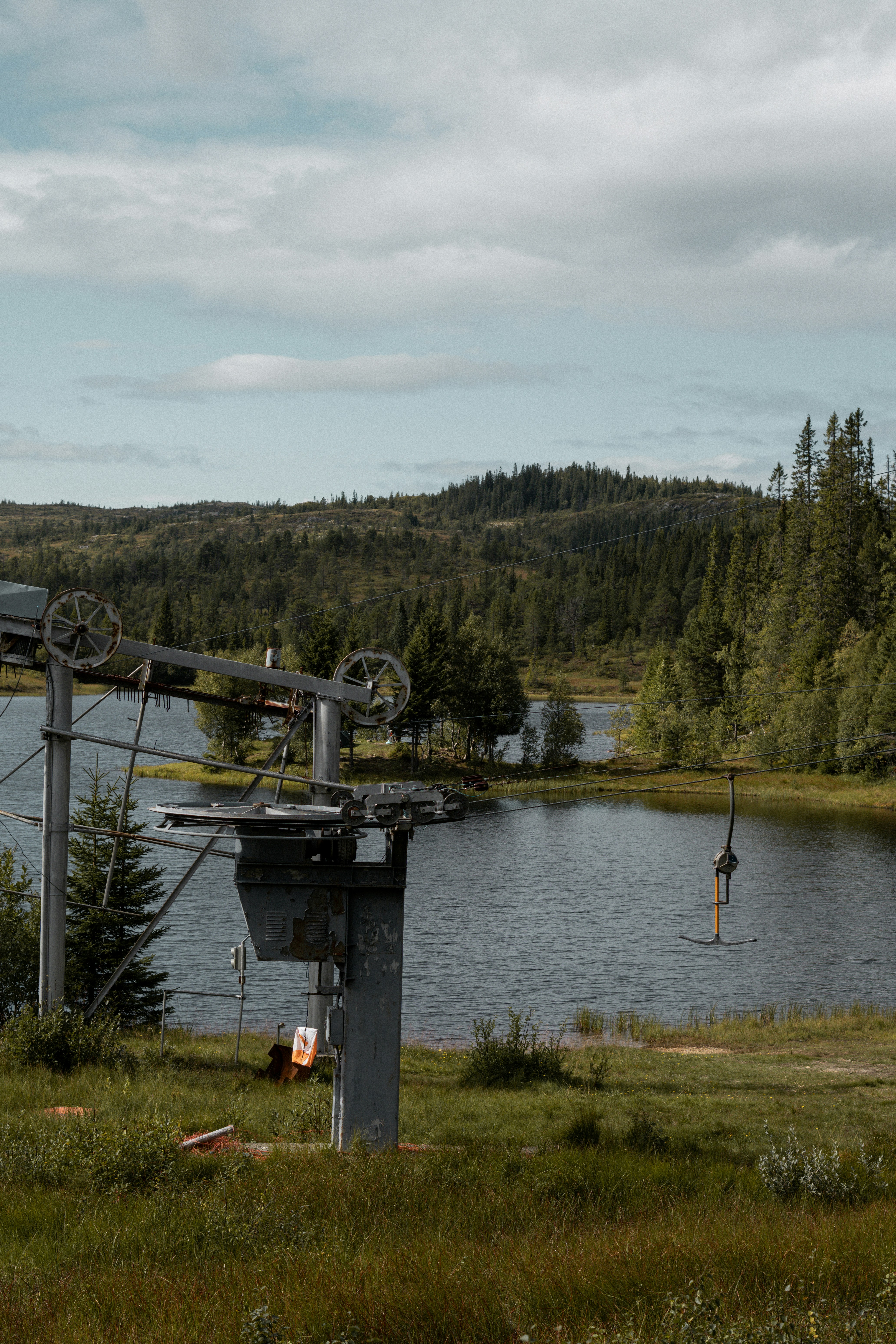 Cable-Driven Ridgetop: an Idle Ski Lift Bracing a Quiet Reservoir
