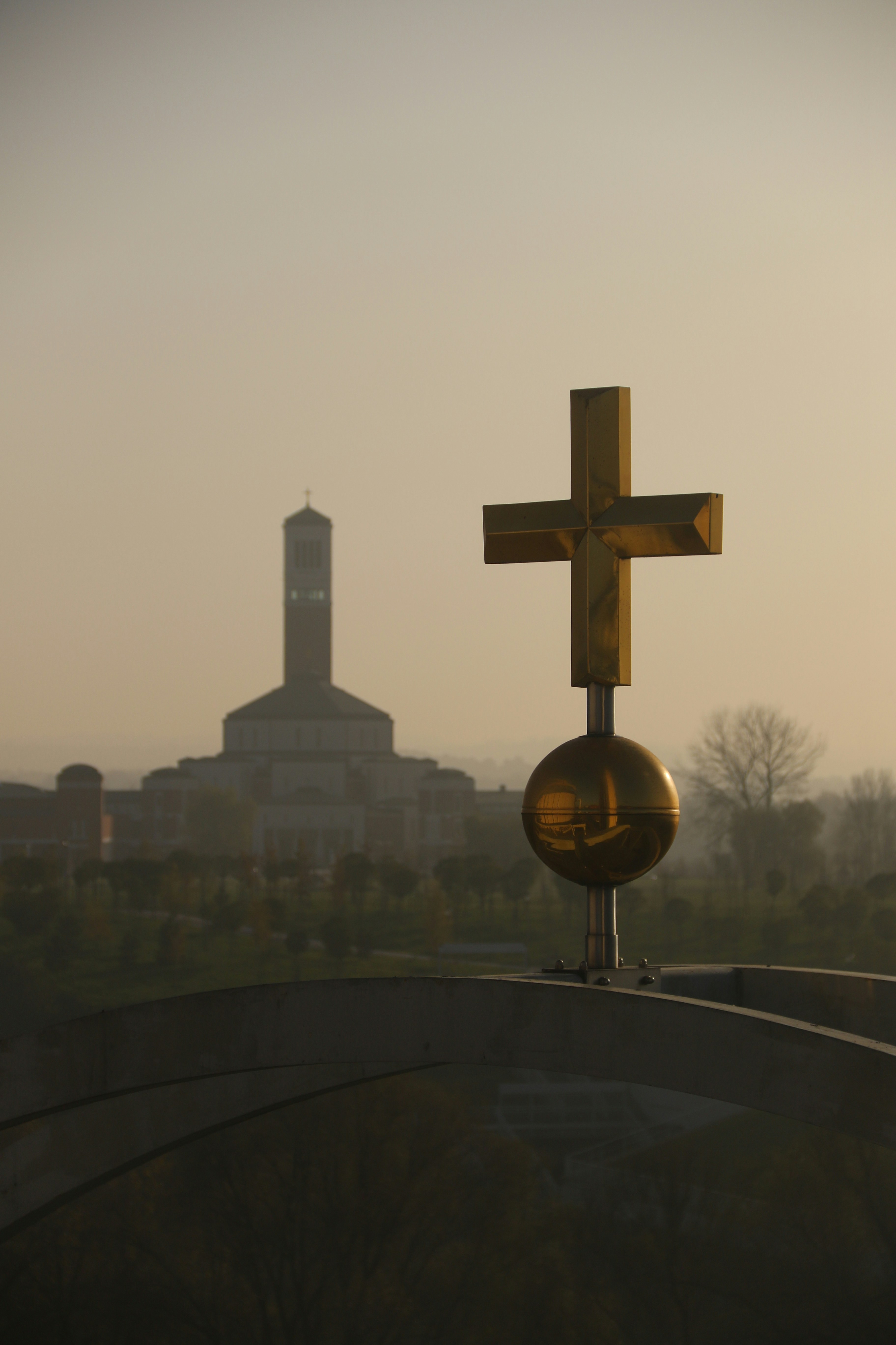 Dawn's Golden Cross Over a Quiet Cityscape
