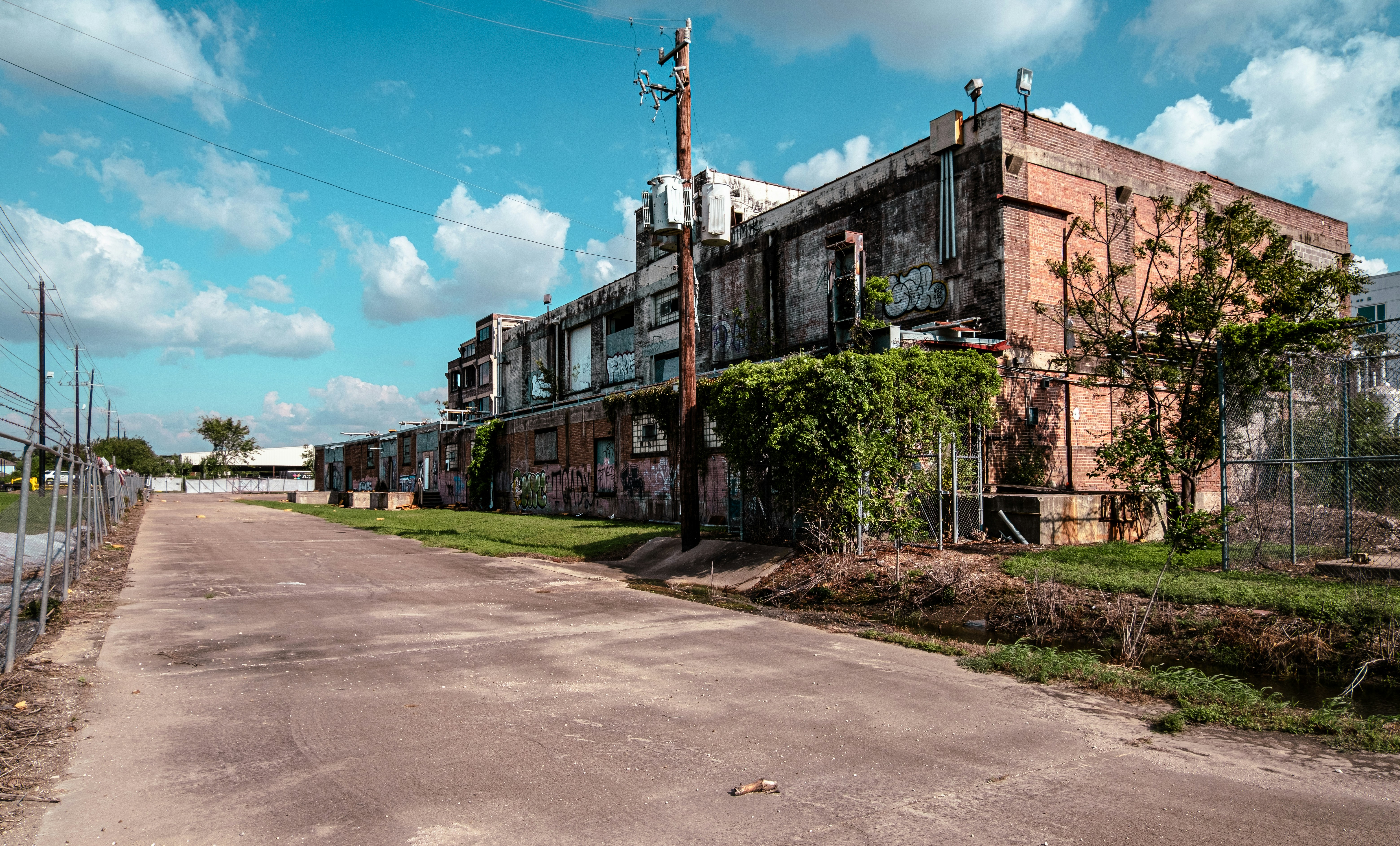 An old building with a lot of windows on the side of it photo – Free ...