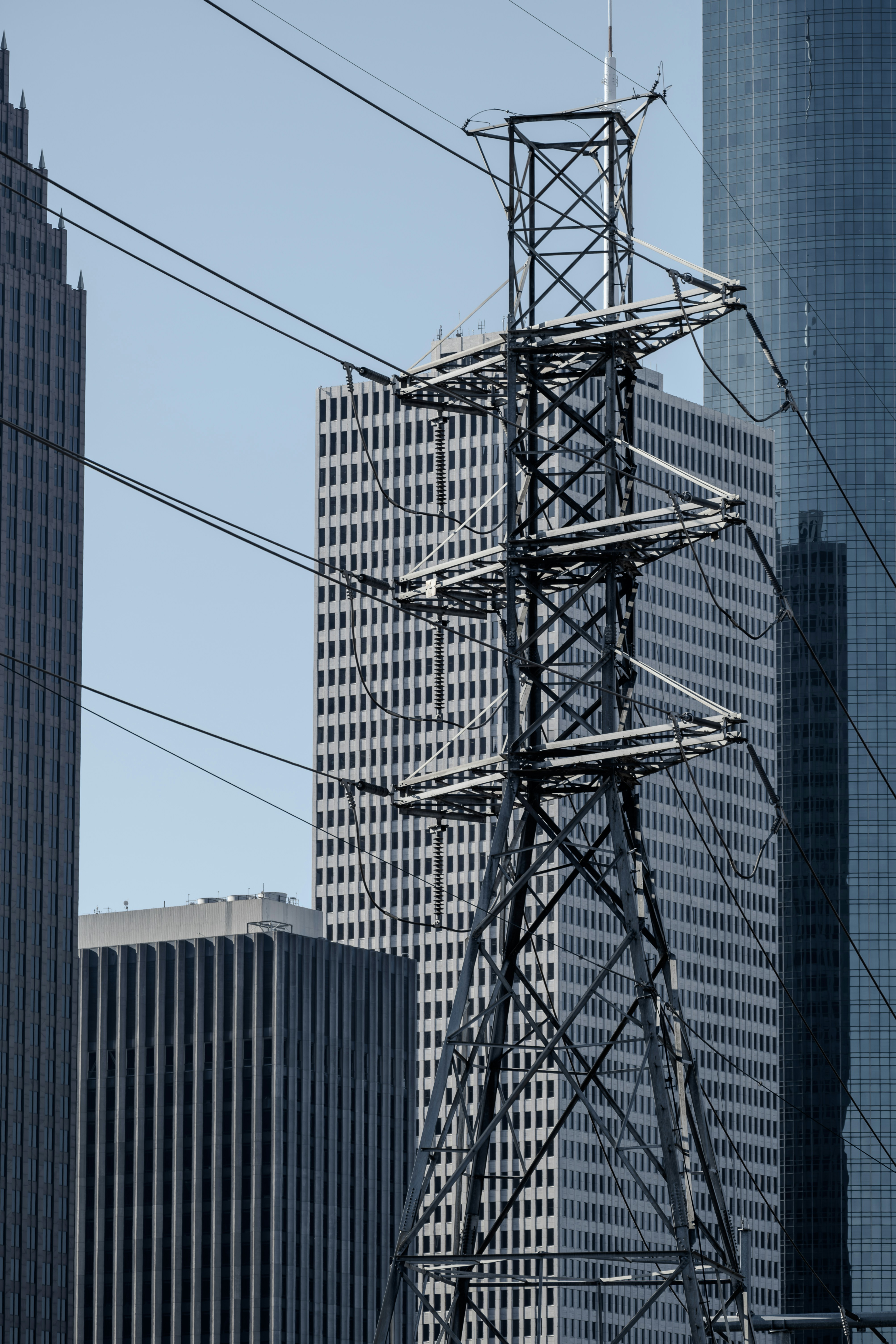Crisscrossed Steel Tower Framing a City of Glass