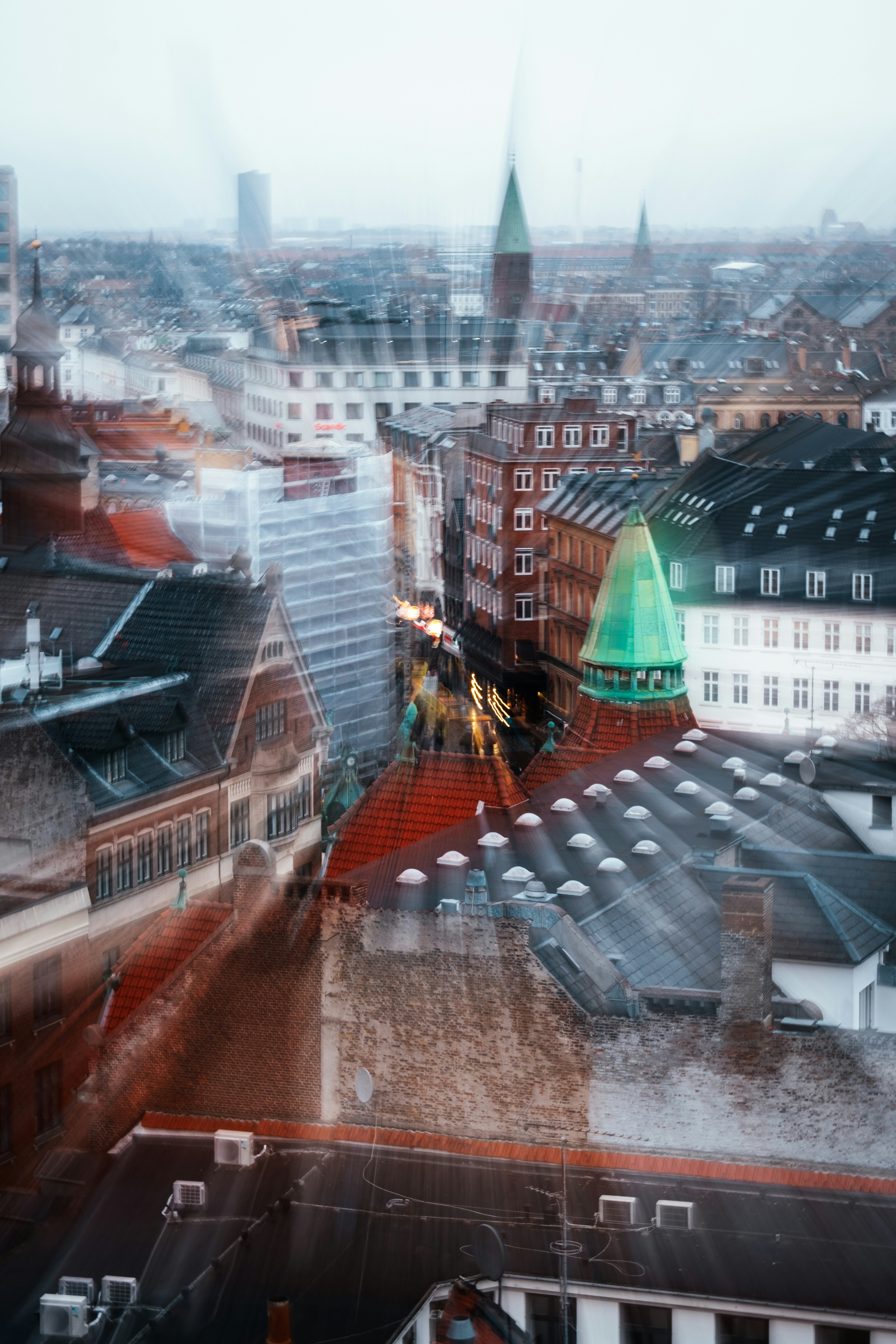 Emerald Spire Over Glass-City: A Layered Urban Vista