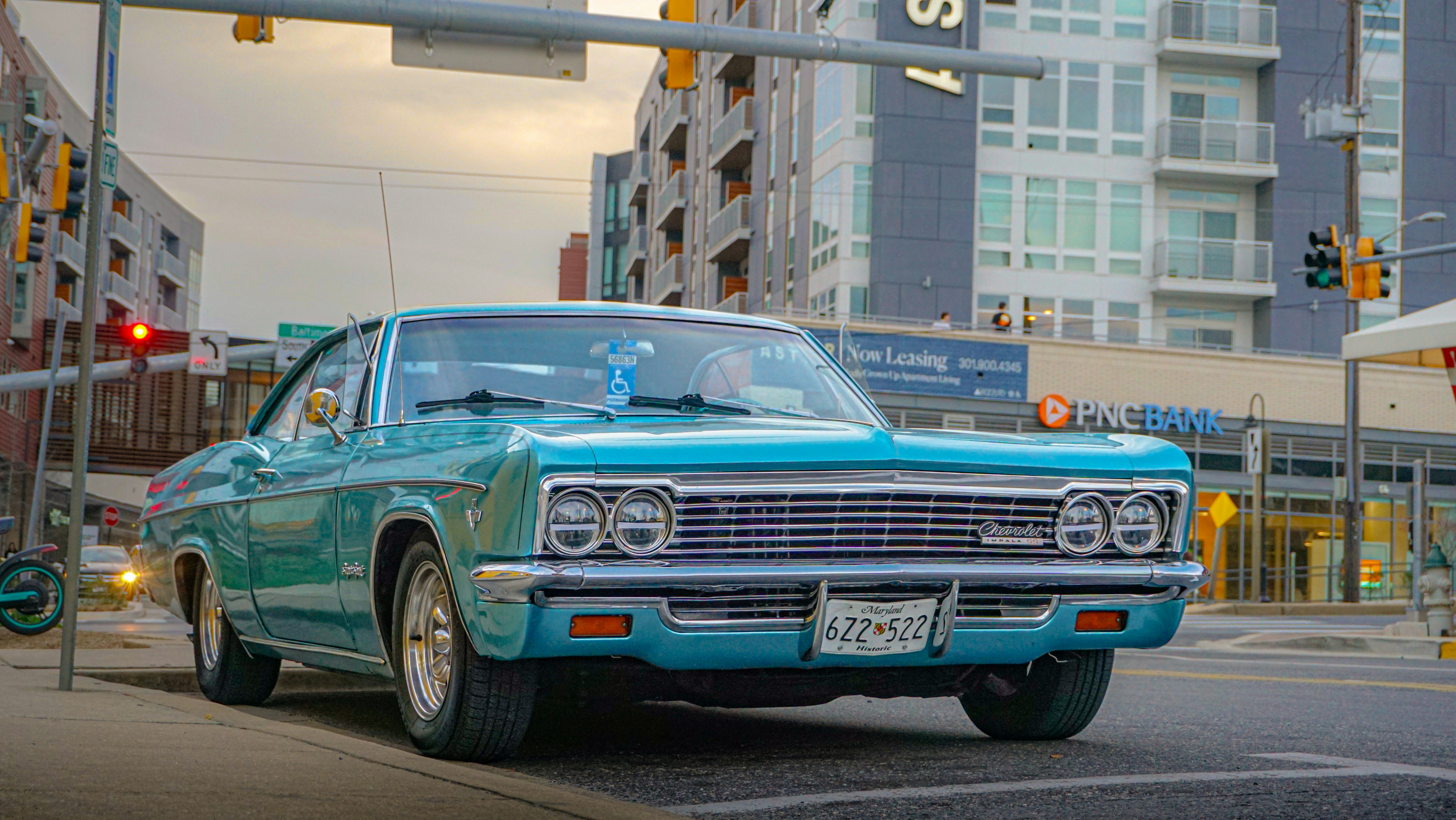 Mint Turquoise Cruiser at a Neon-Quiet Downtown Intersection