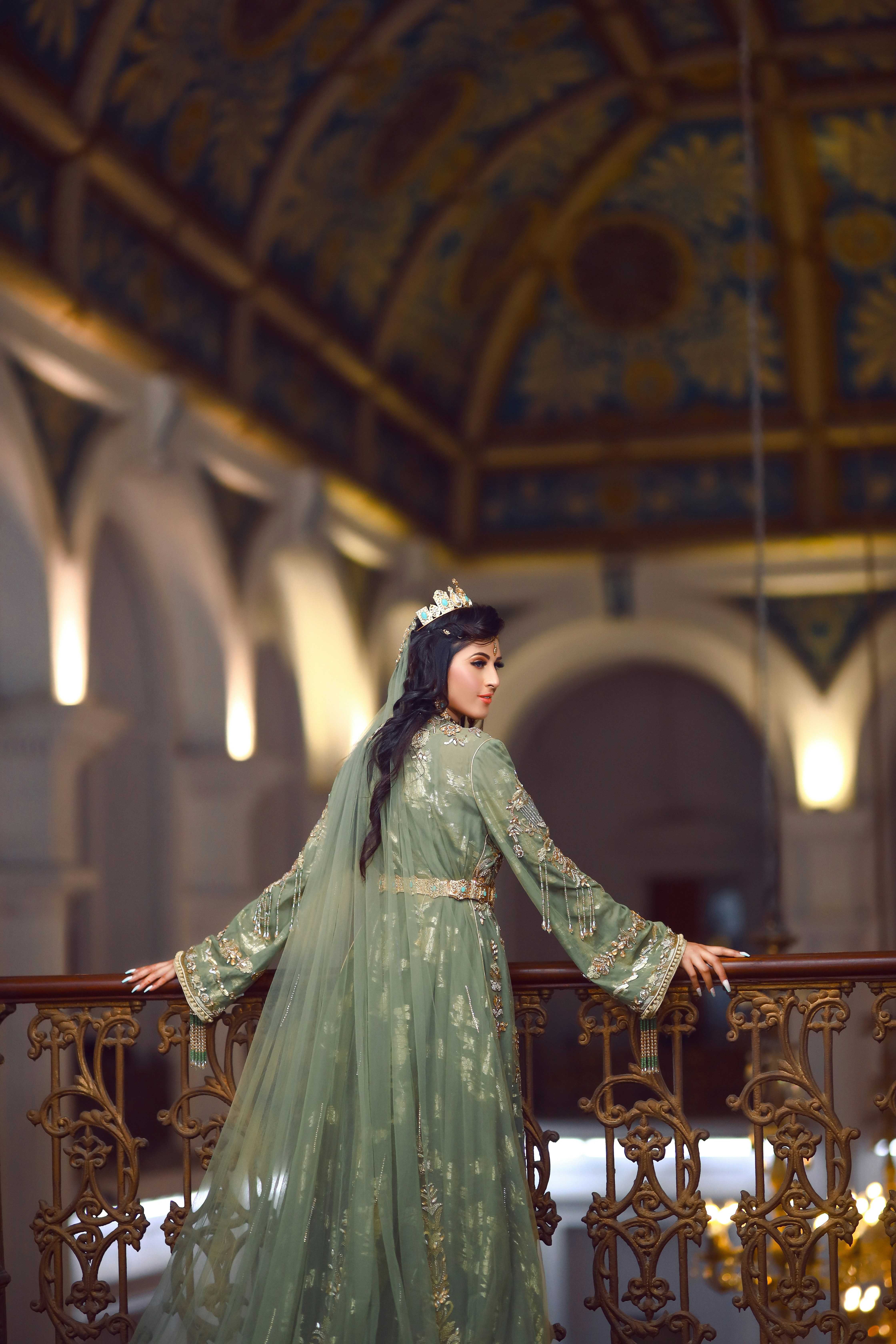 Emerald Grace on a Gilded Balcony