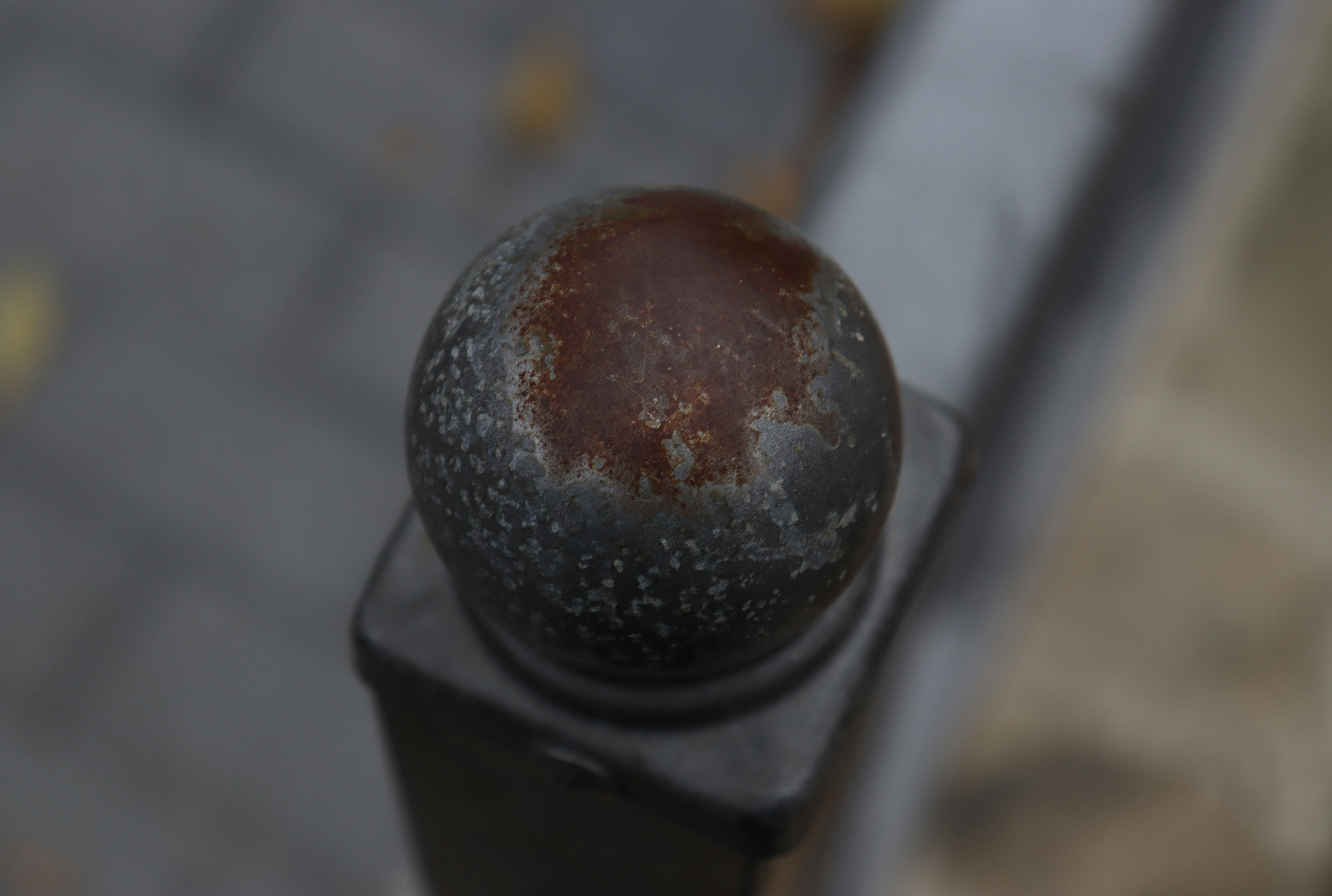 Patina in the Frost: A Close-Up on a Weathered Rail Ball