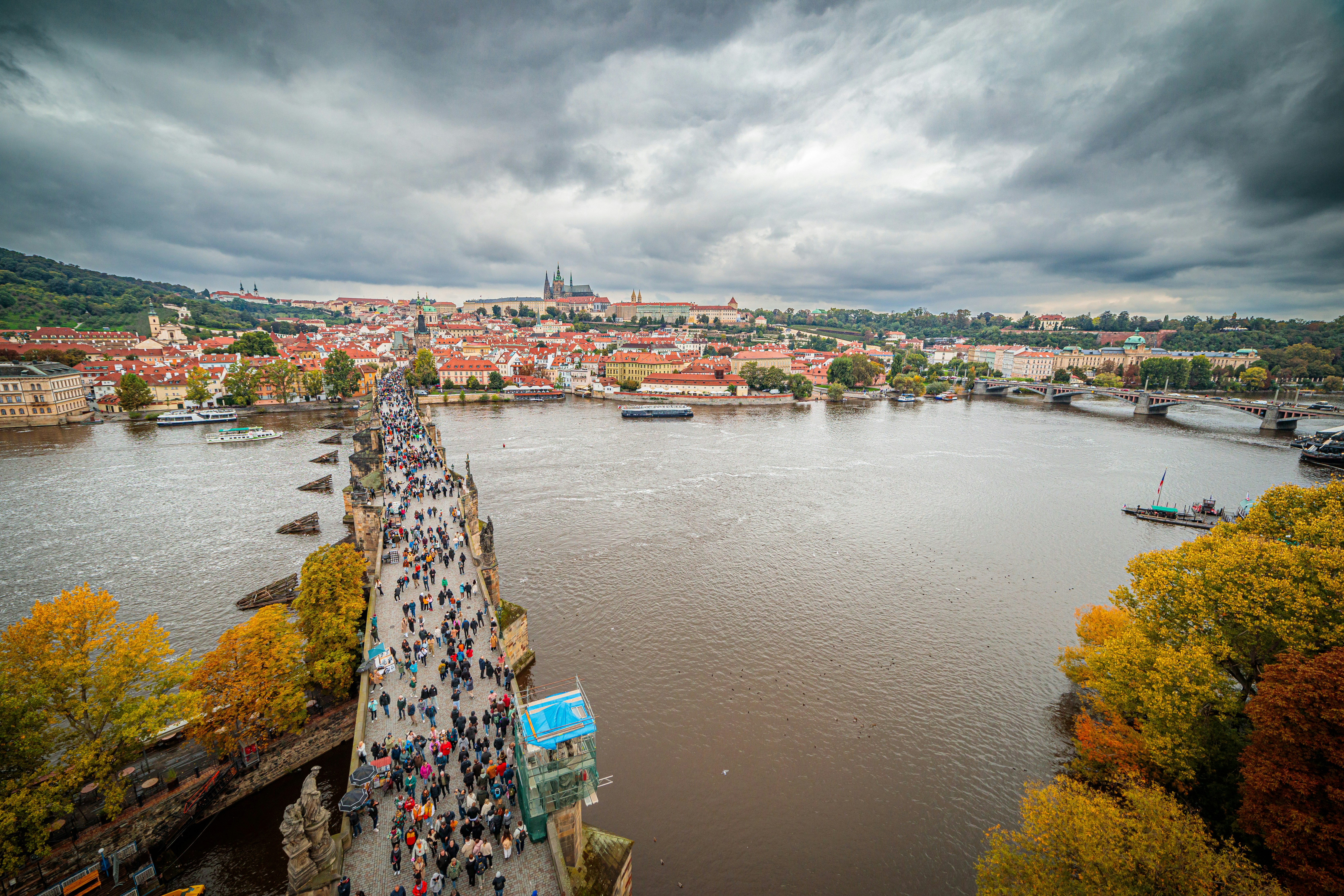 A large group of people walking across a bridge photo – Free Travel ...