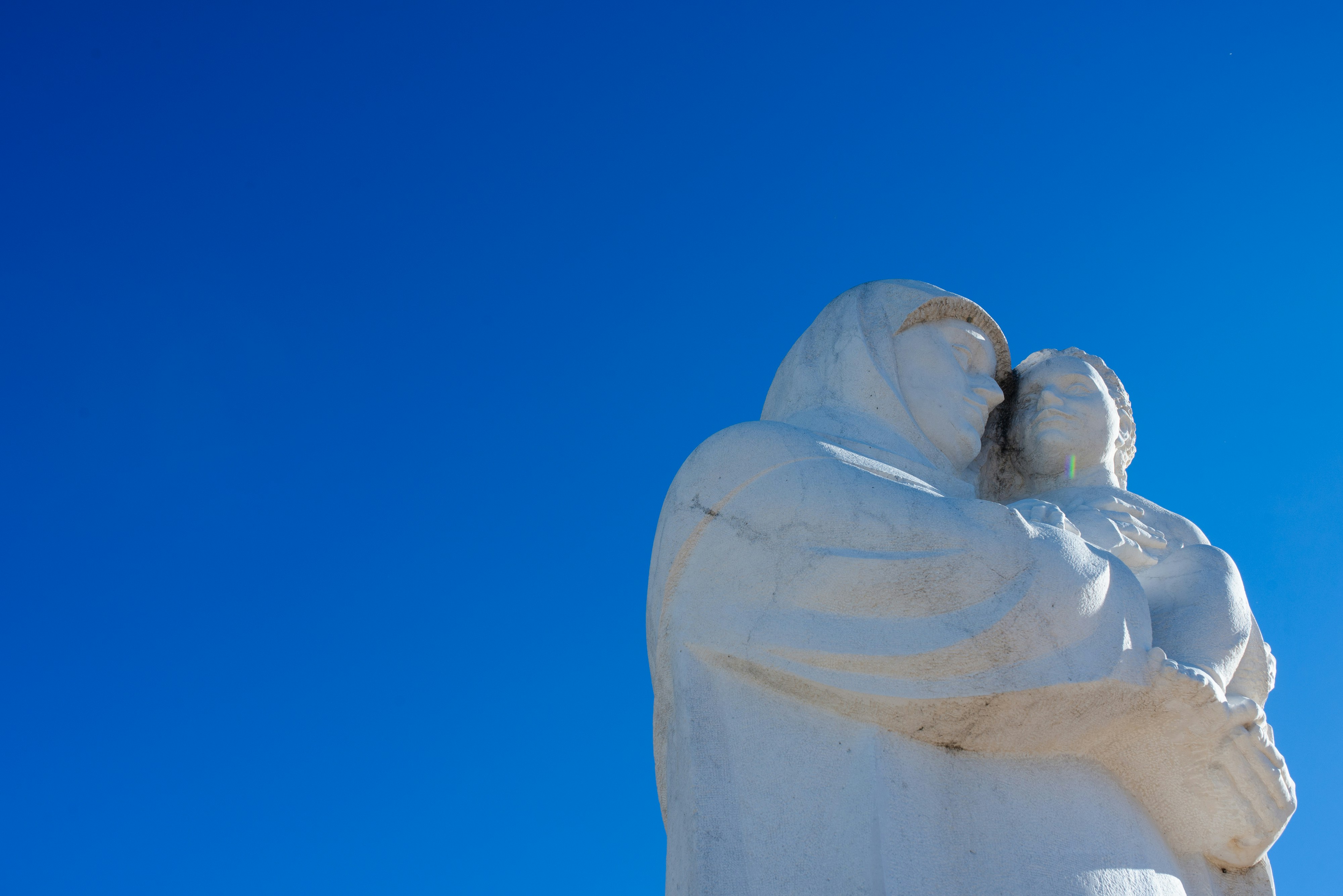 Stone Embrace Against a Cerulean Sky