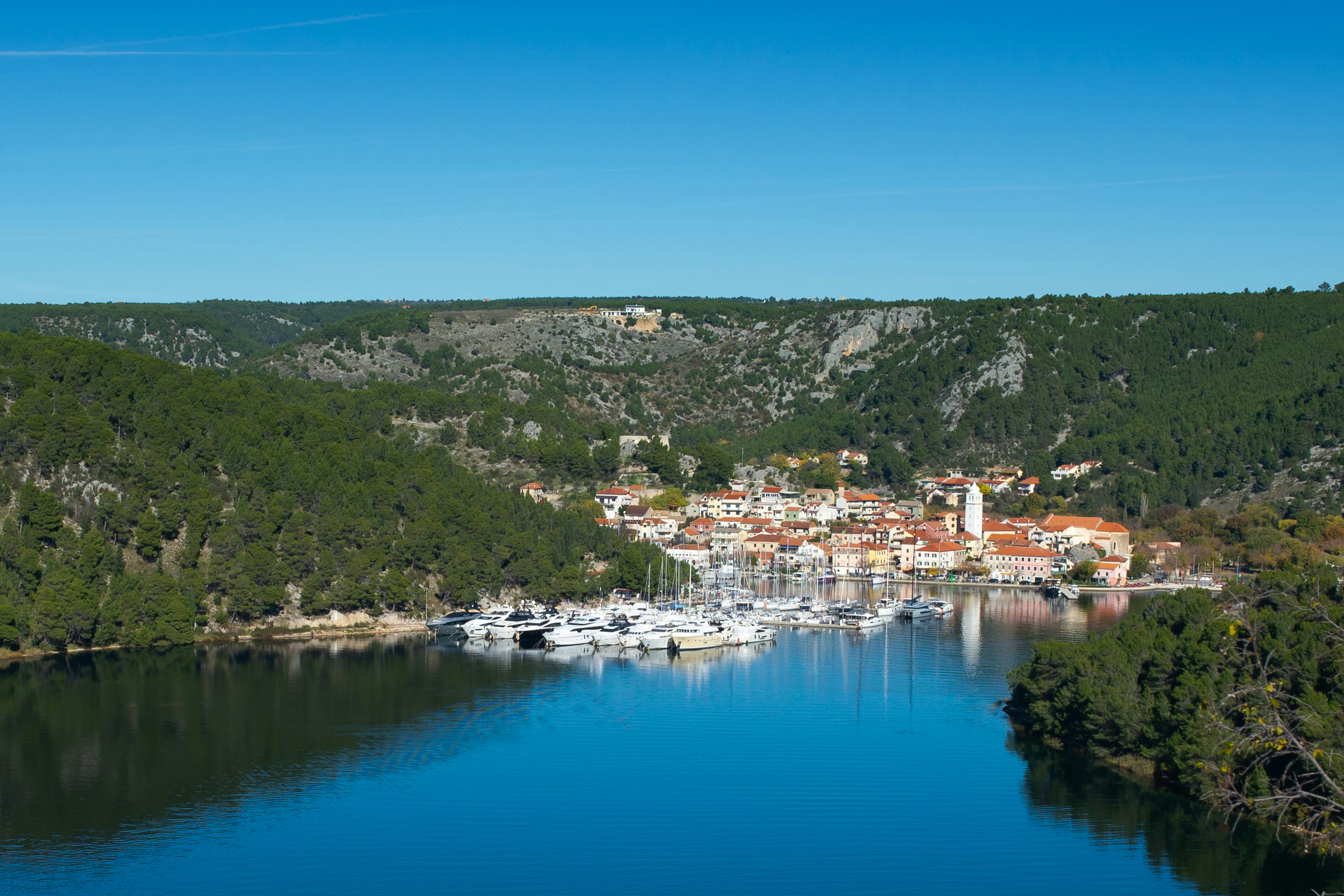 Marina Glint: A Corsican-like Cove Nestled Between Green Ridges