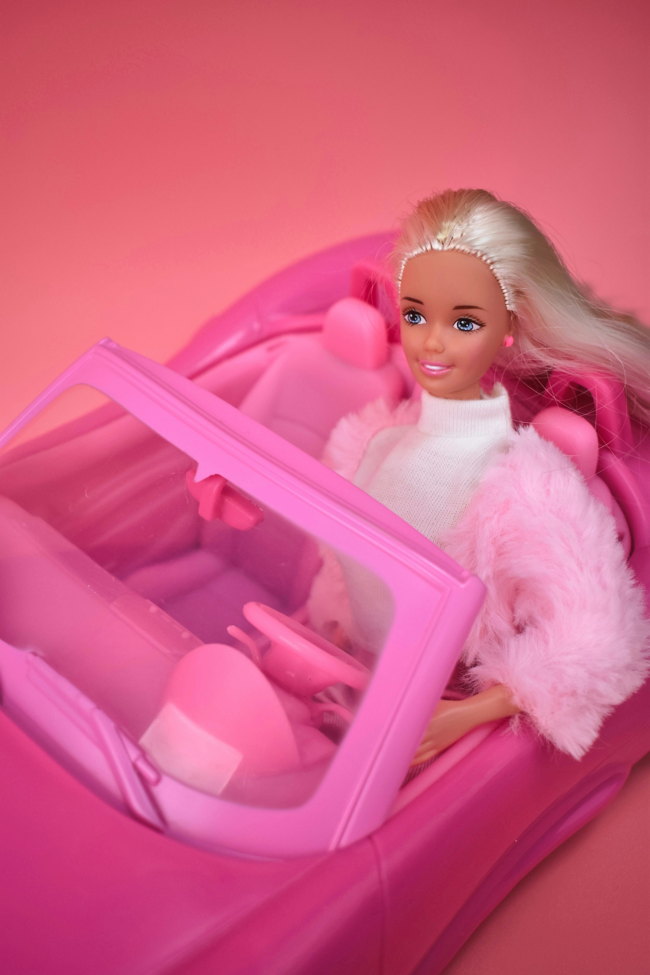 A barbie doll sitting in a pink car photo – Free Doll Image on Unsplash