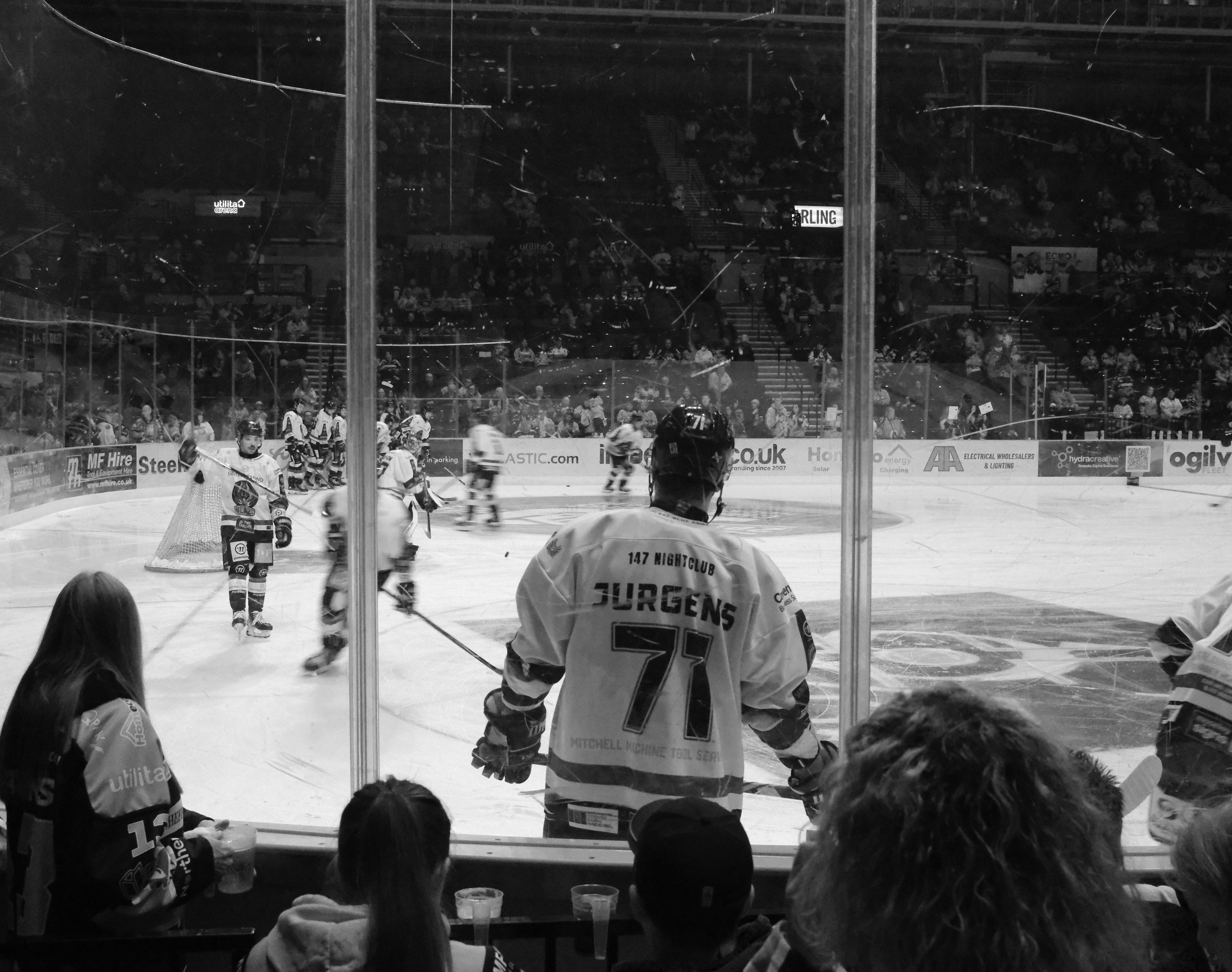 Jurgens at Center Ice: A Quiet Backturn in a Grayscale Arena