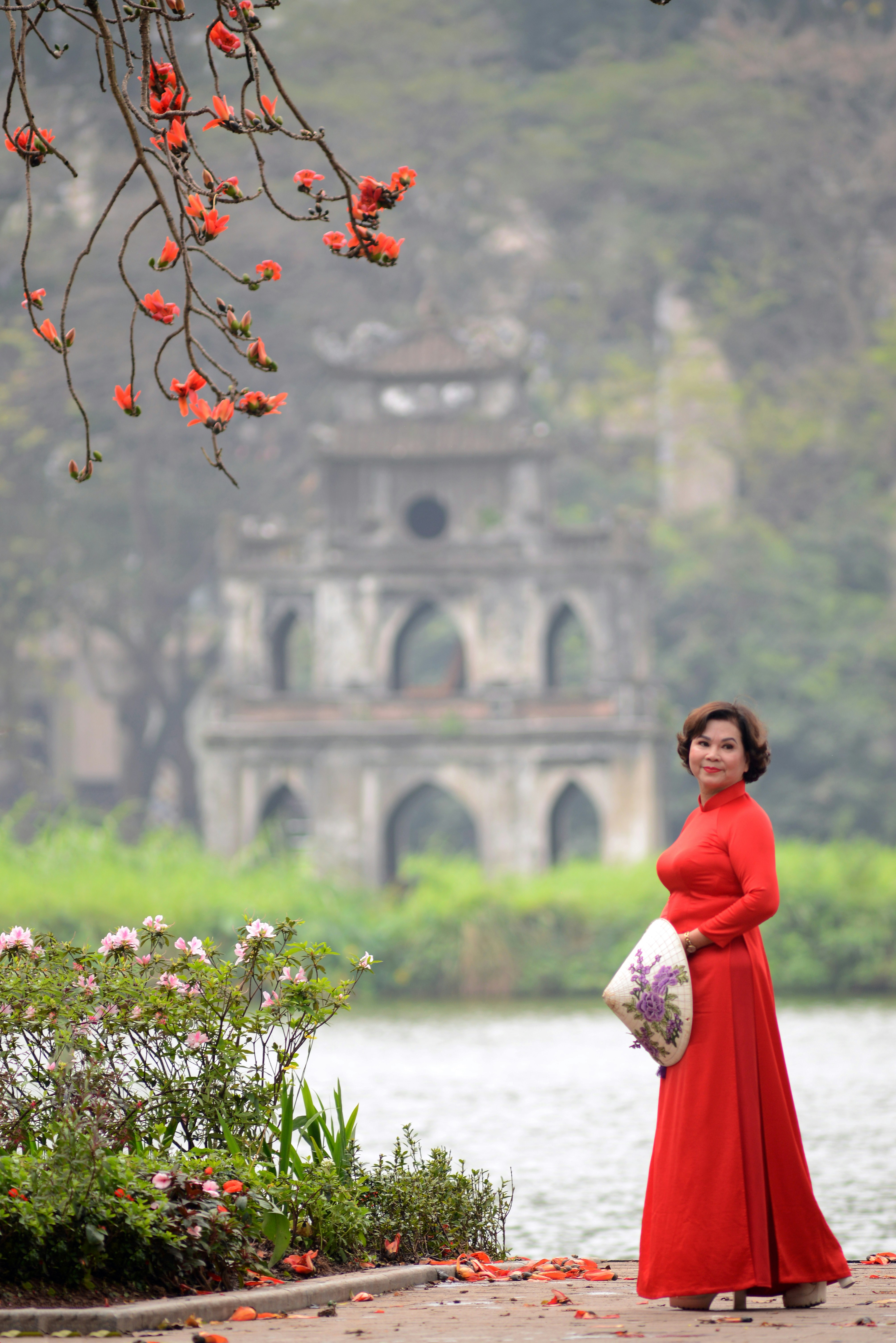 Crimson Grace by the Pond: A Confident Red Dress at the Garden Gate