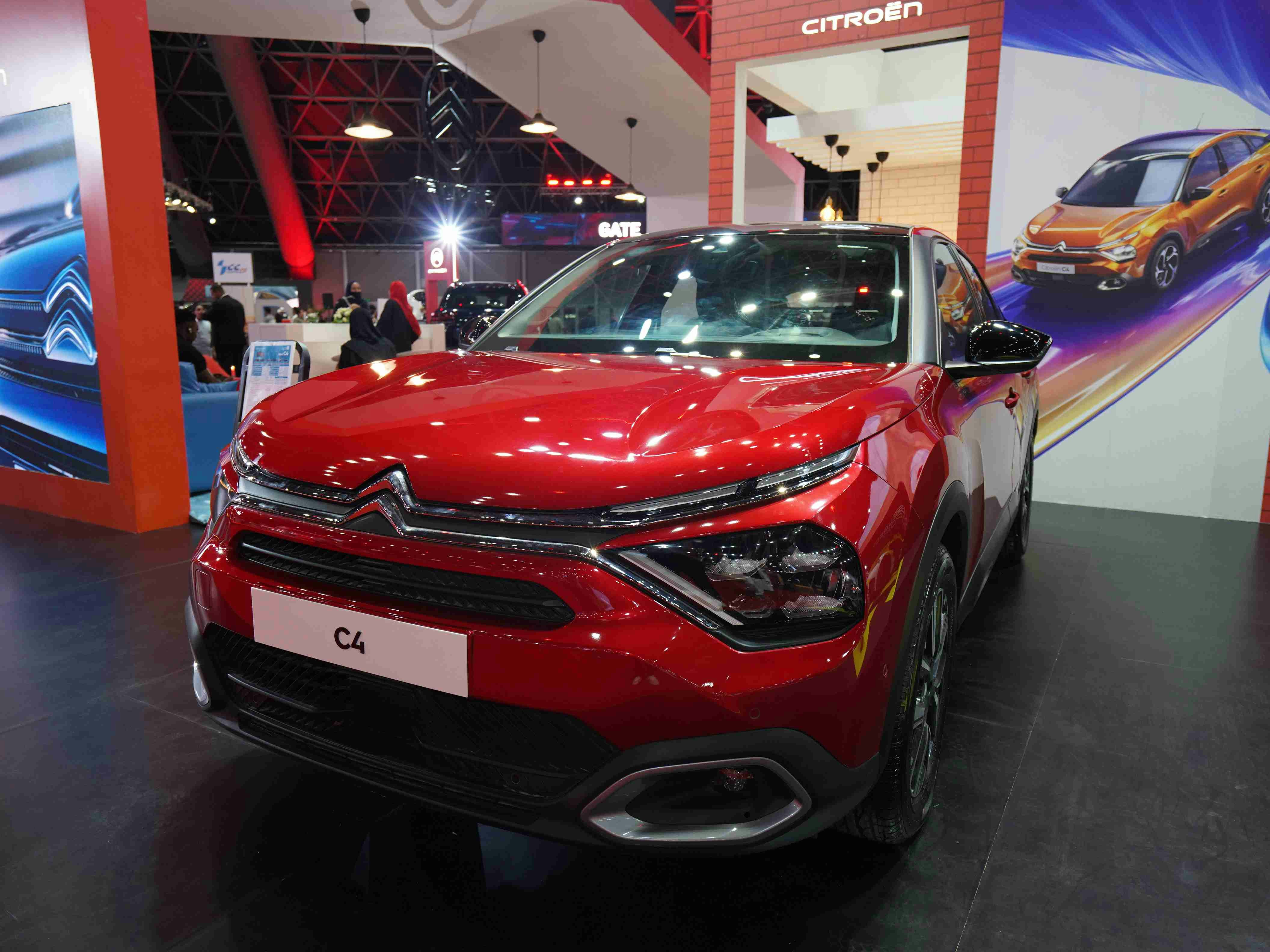 A red car on display at a car show photo – Free Car Image on Unsplash