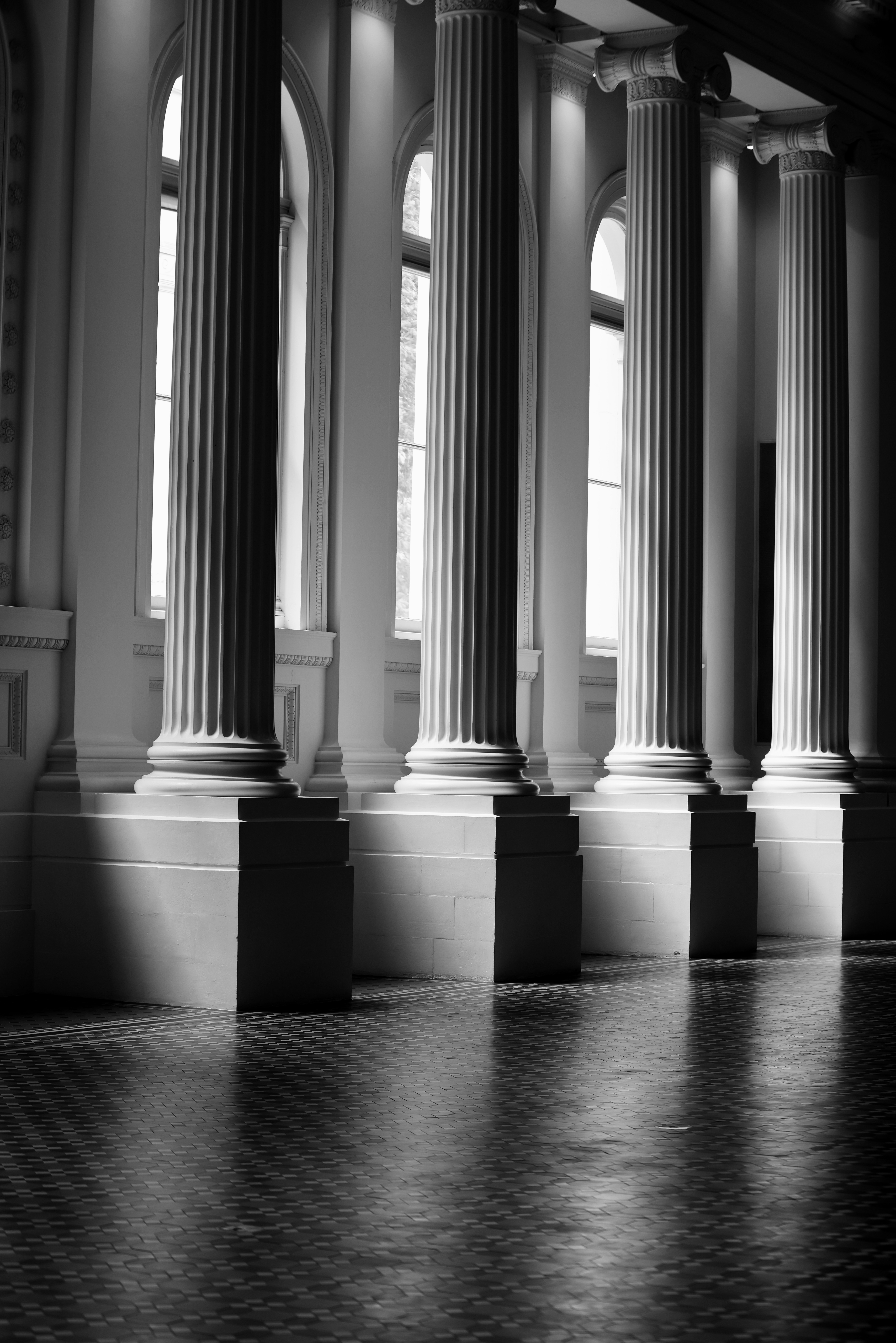 A black and white photo of columns and windows photo – Free Building ...