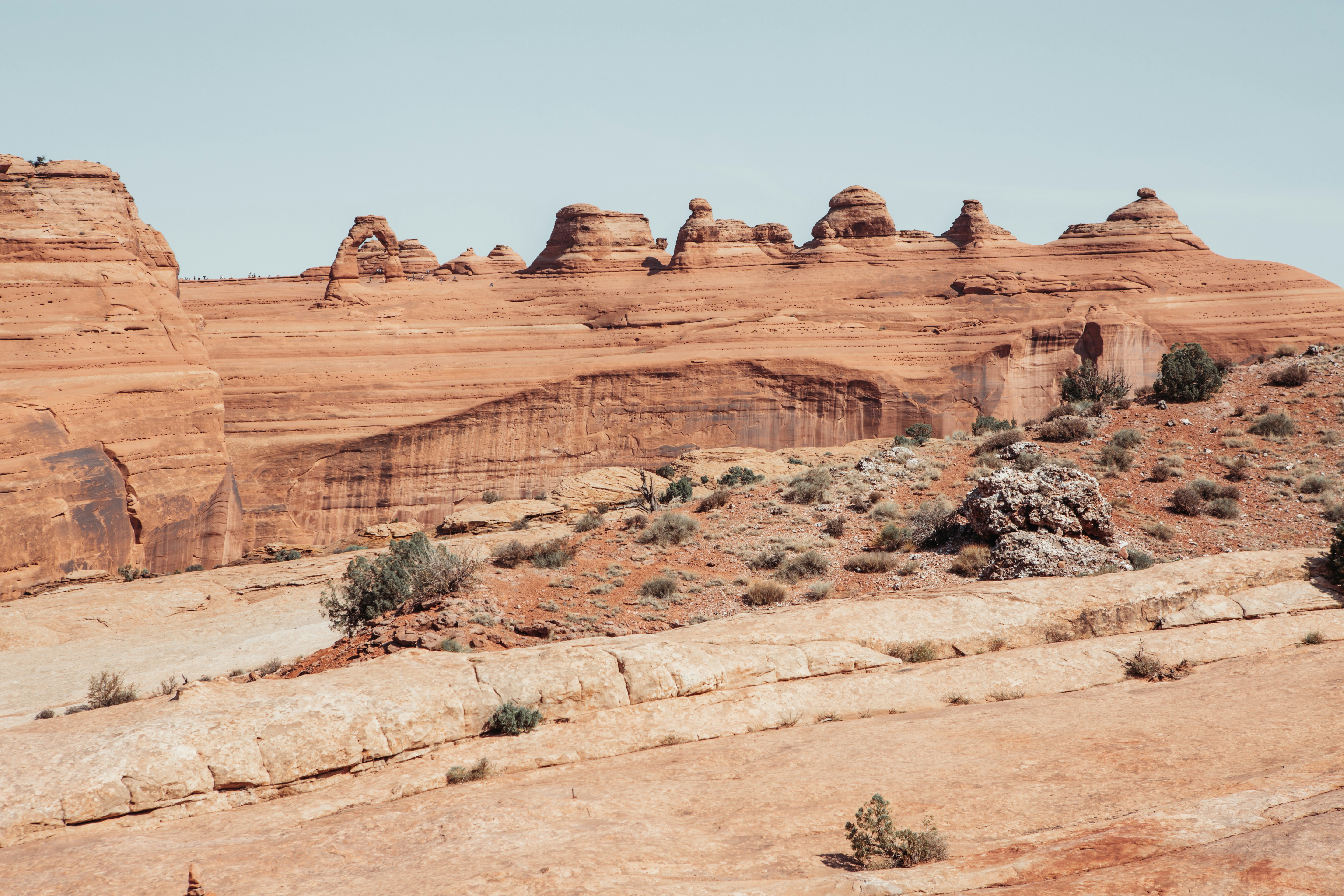 A desert landscape with rocks and plants in the foreground photo – Free ...