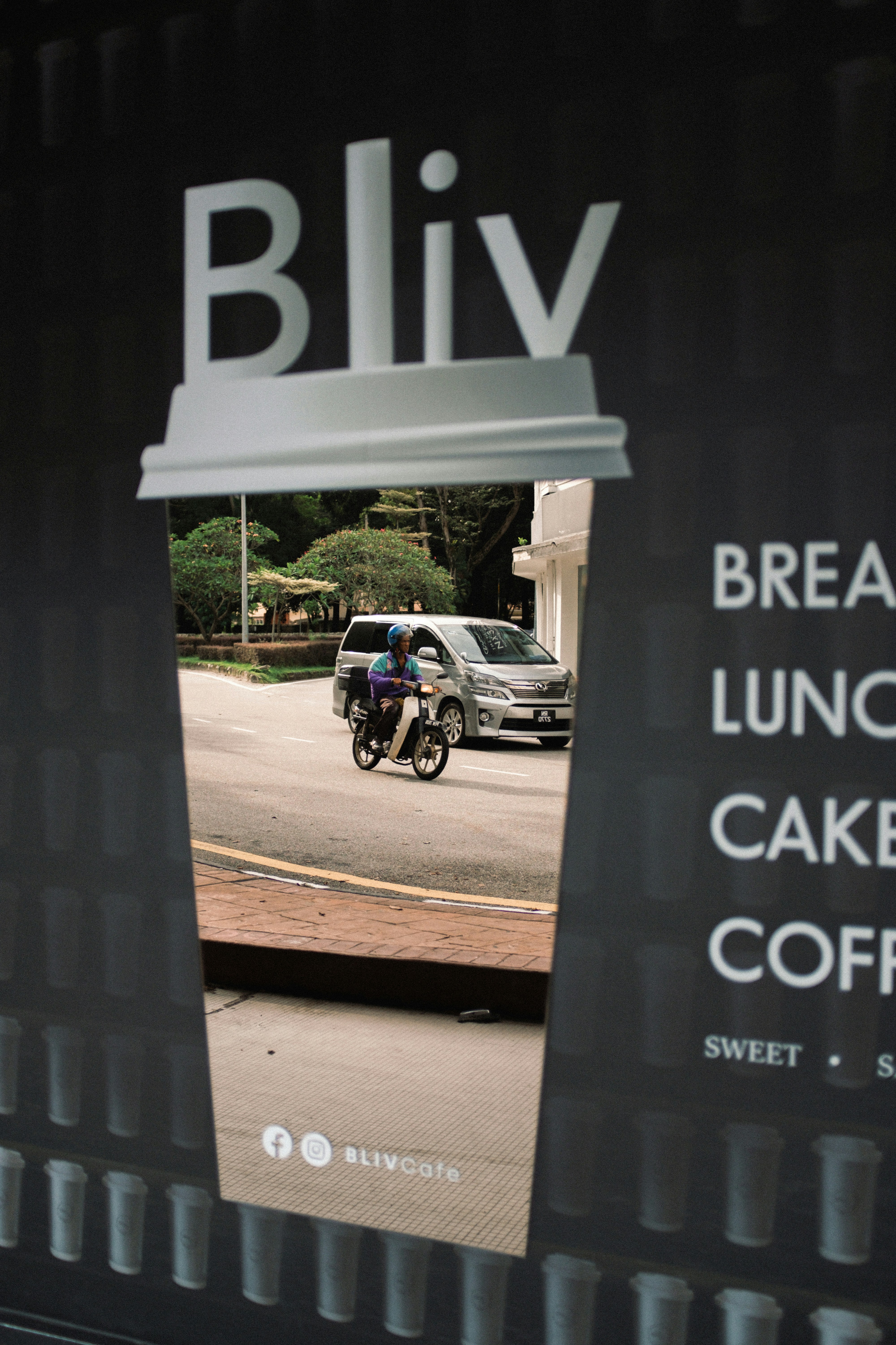 A billboard with a picture of a person on a motorcycle photo – Free ...