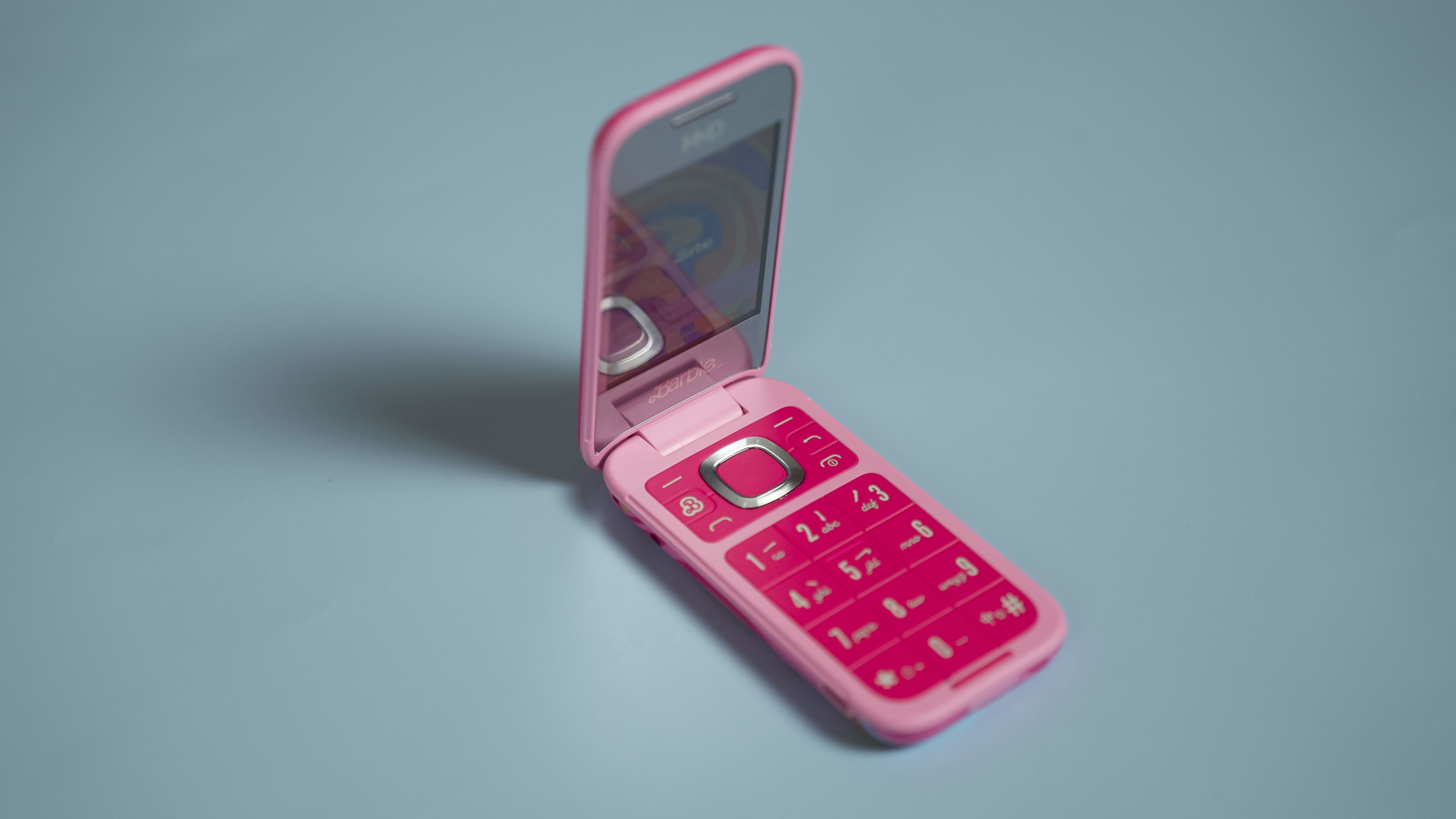 A pink cell phone sitting in a pink case photo – Free Phone Image on ...