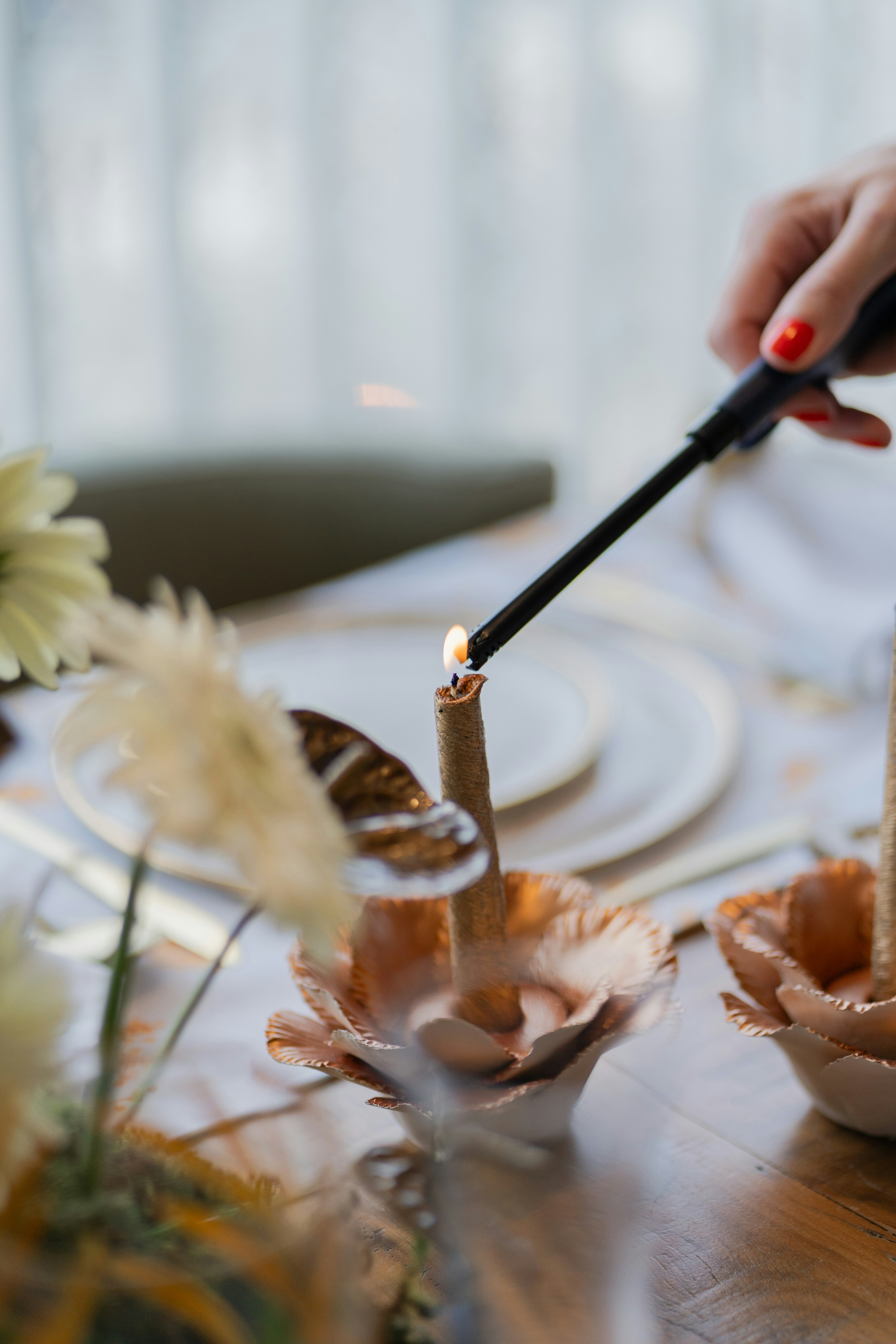 A Candle Flame Illuminates a Quiet Table Setting
