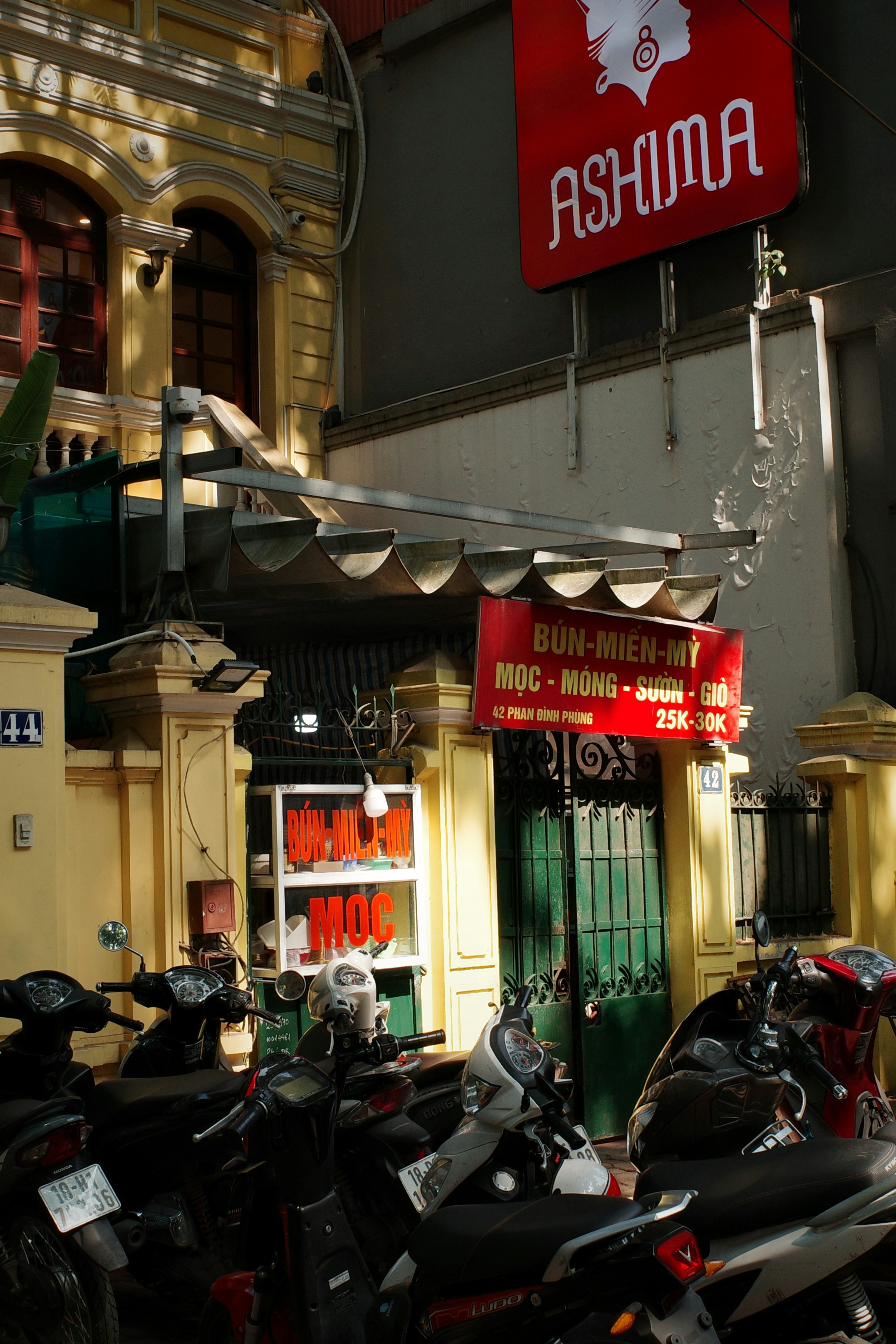 Ashima Above a Scooter-Cluttered Vietnamese Street