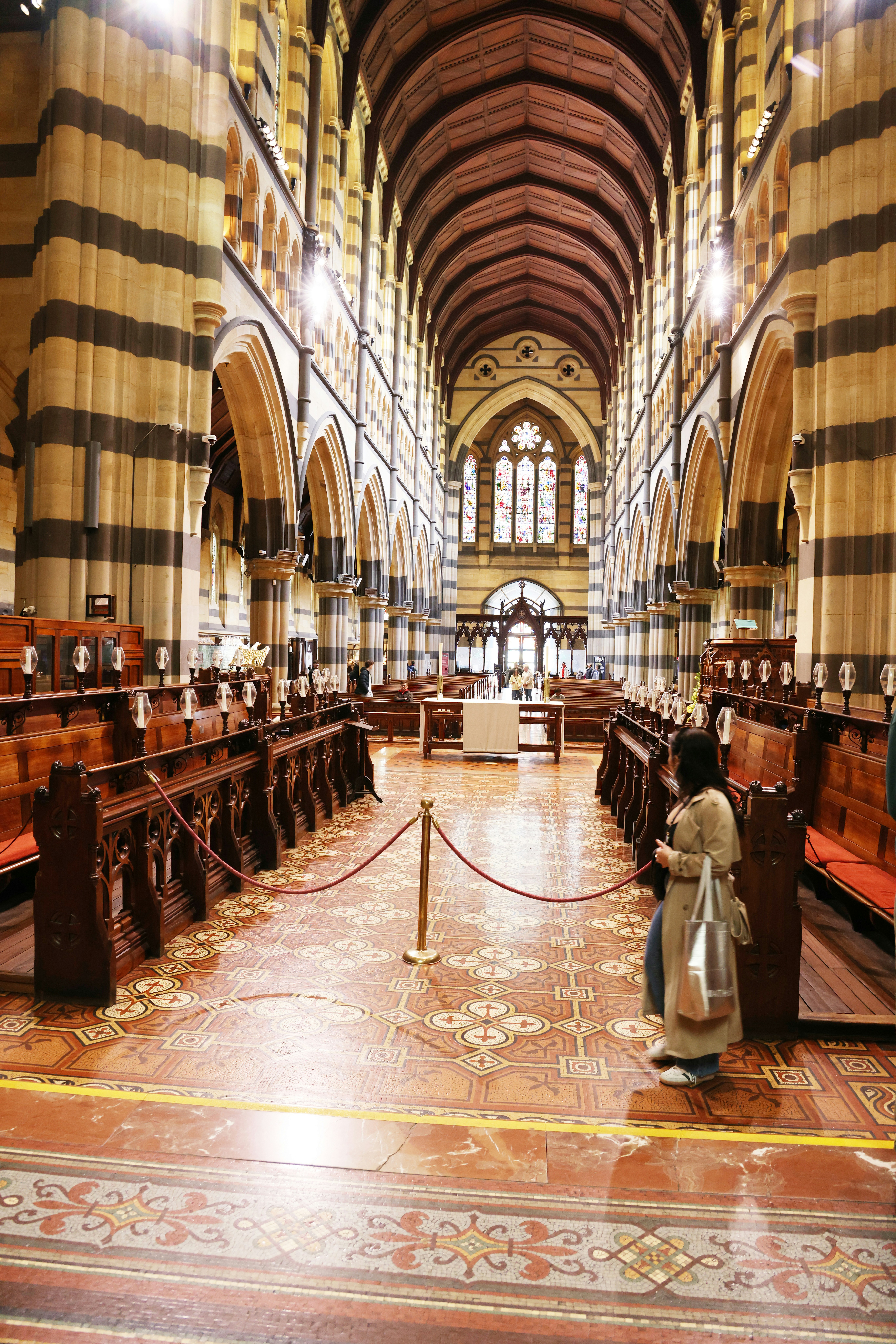 A large cathedral with a long row of benches photo – Free Woman Image ...