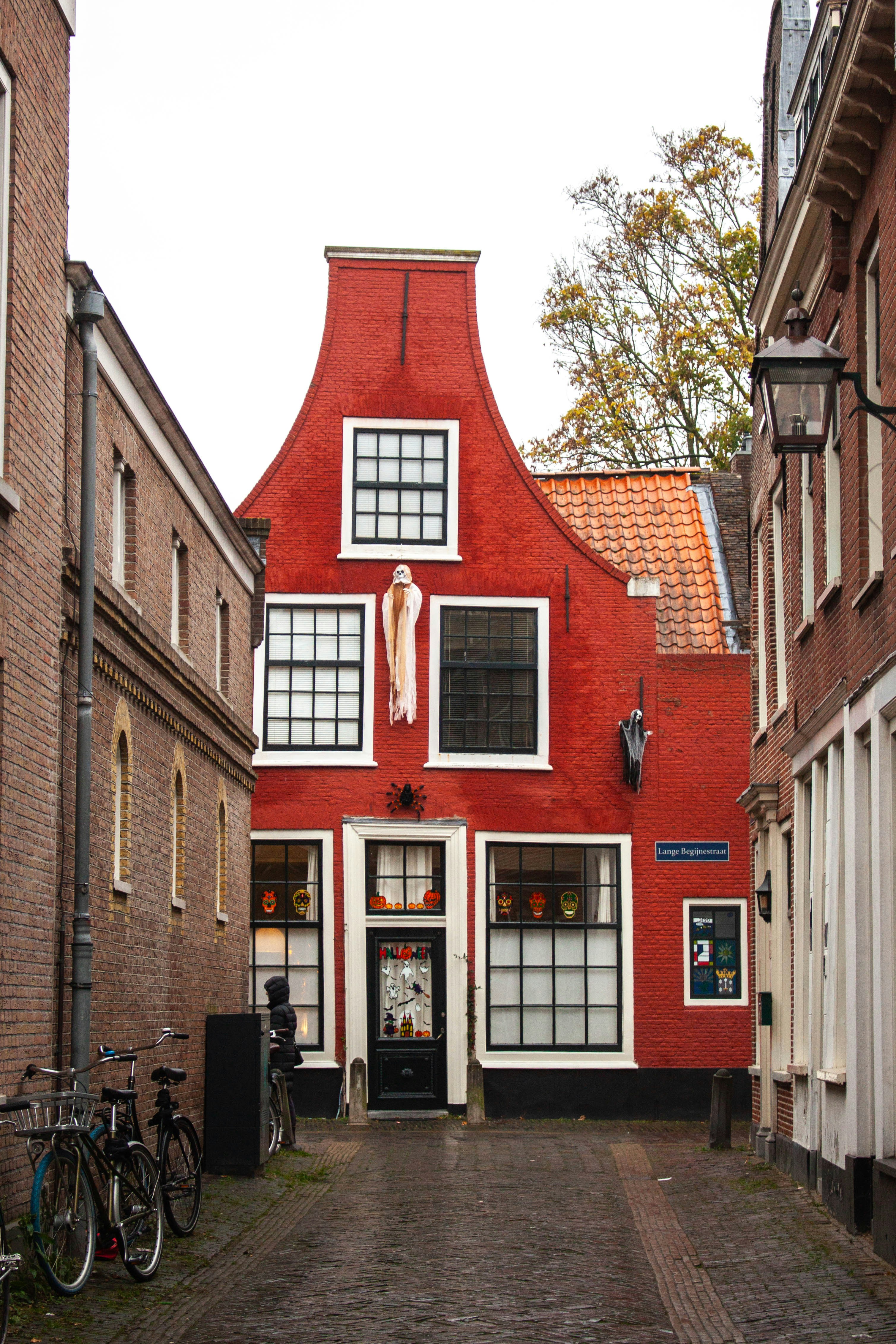 Crimson Gable on a Cobblestone Lane