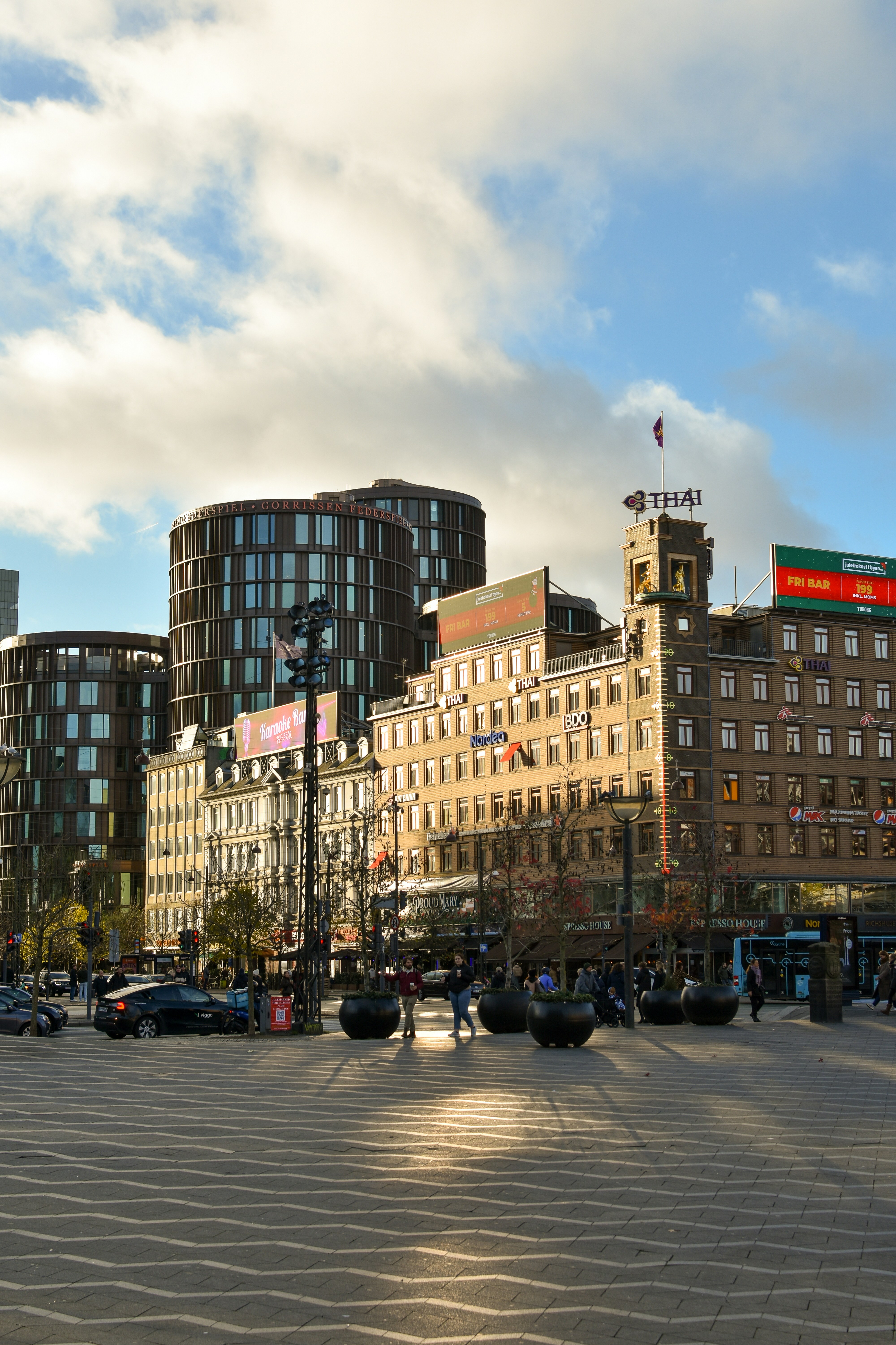 Cityscape Confluence: Sunlit Facades and Rising Towers