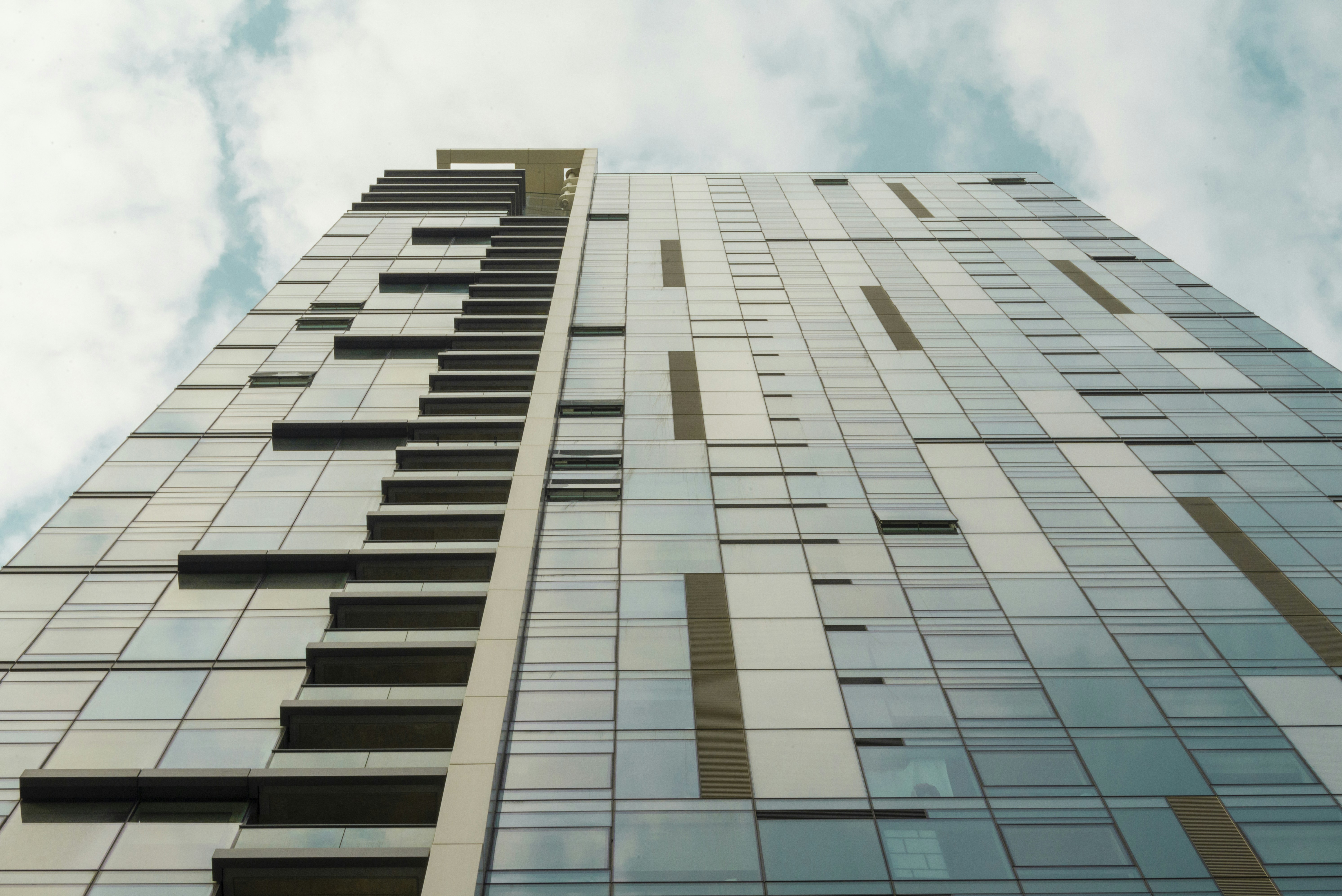 A very tall building with lots of windows photo – Free Windows Image on ...