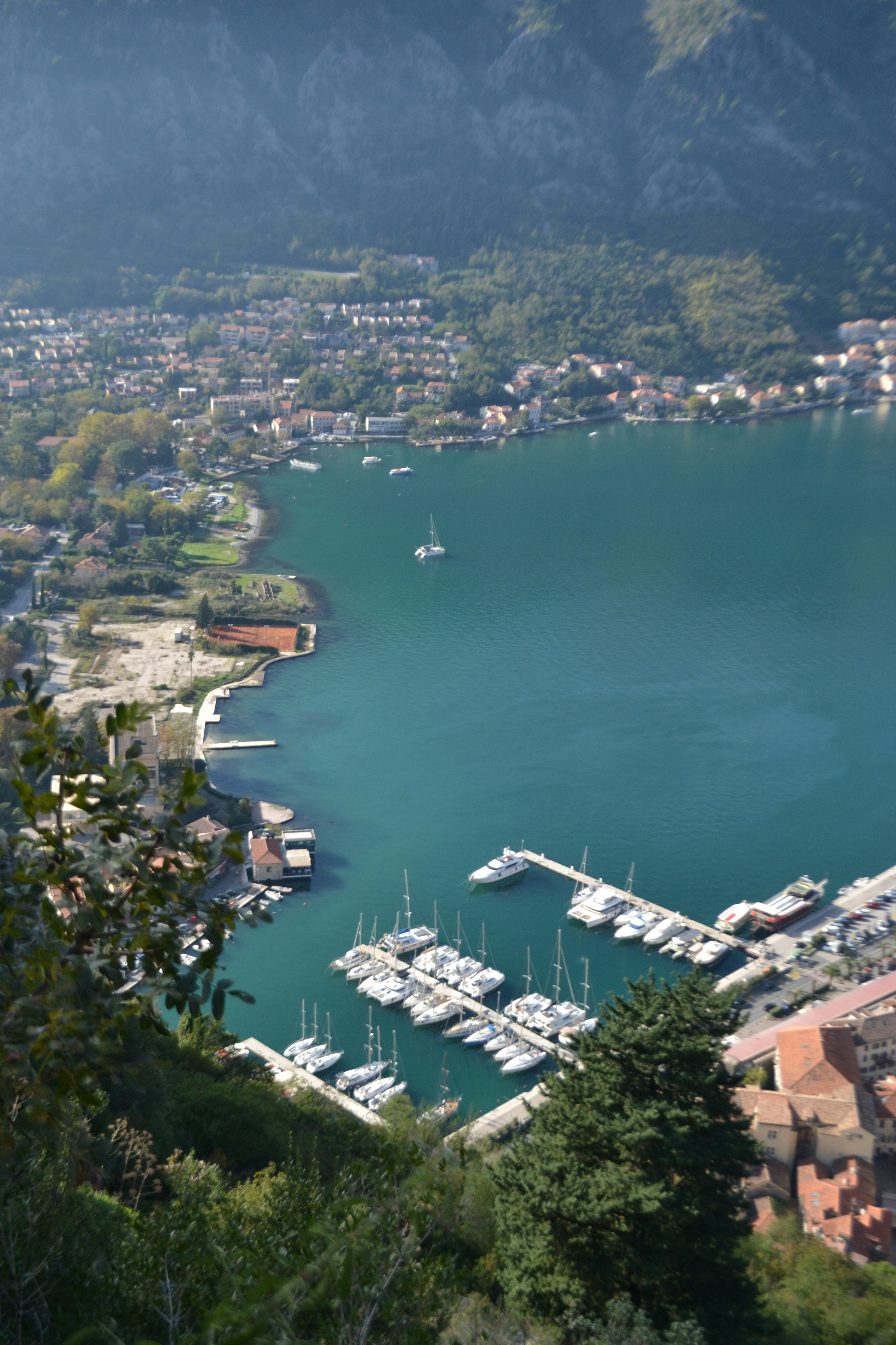 Harbor of Linaria: Aerial View of Boats and Village Along Turquoise Waters