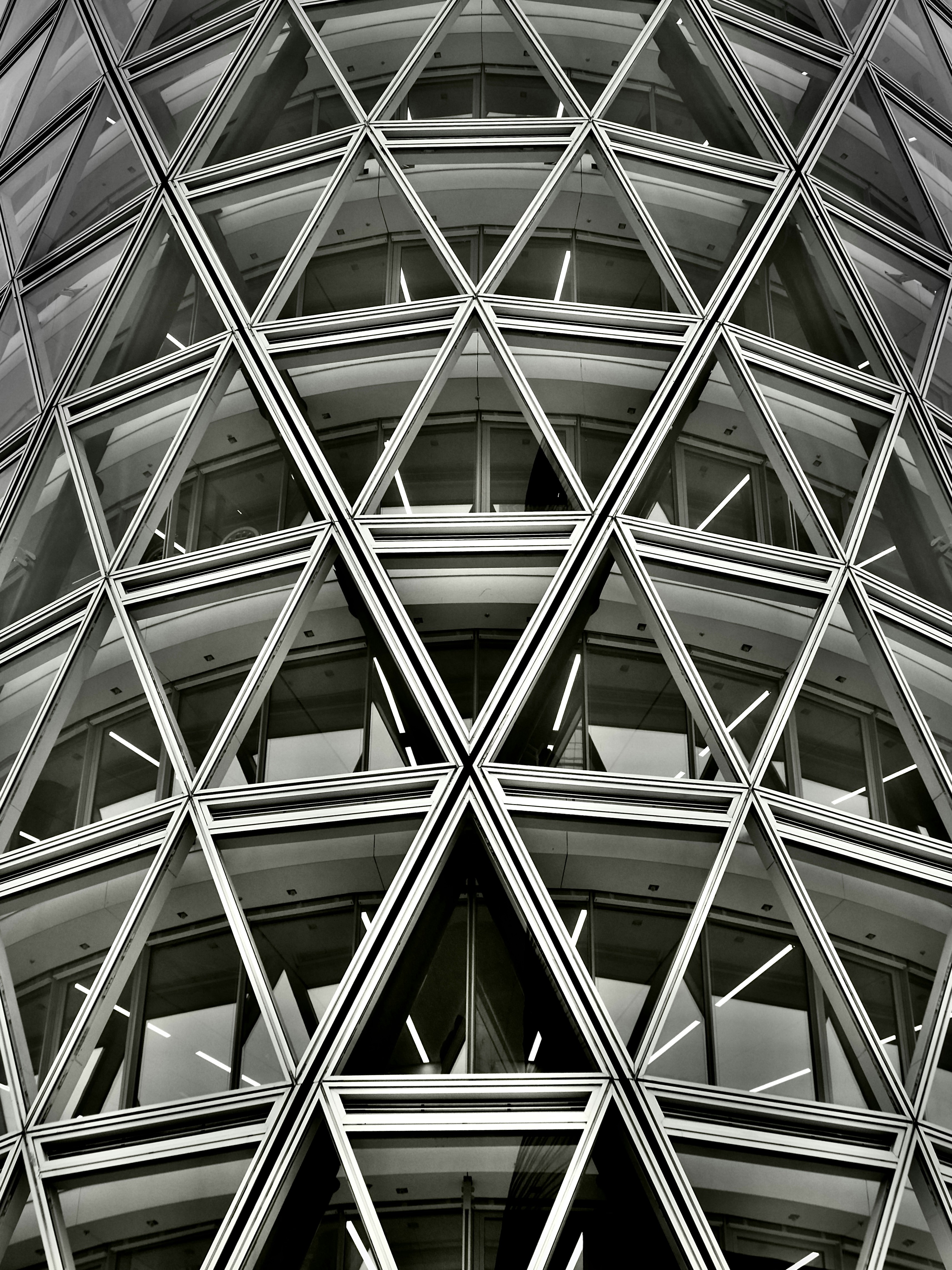 A very tall building with a very large window photo – Free Piazza gae ...