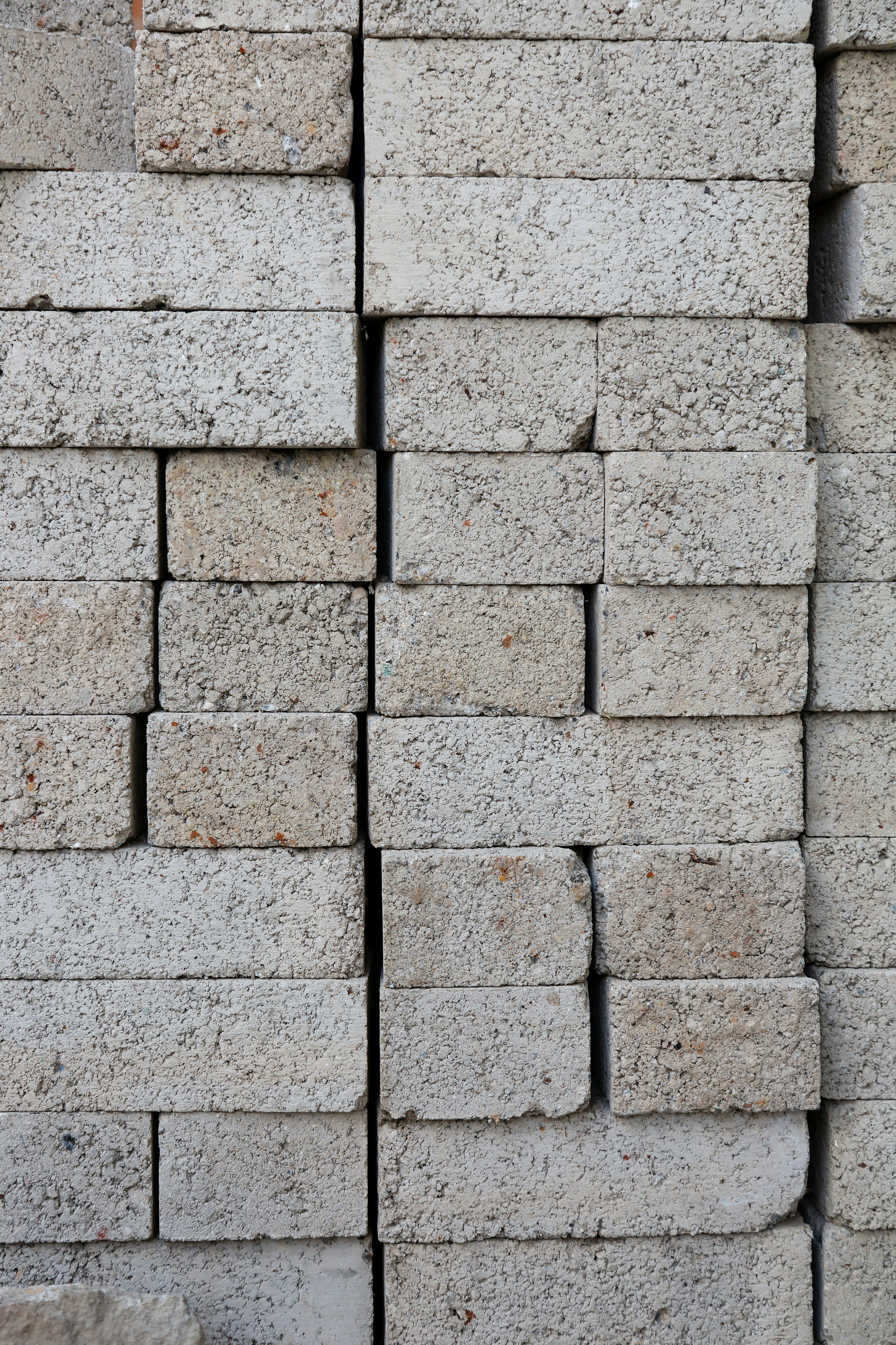 A bunch of bricks stacked on top of each other photo – Free Brick Image ...